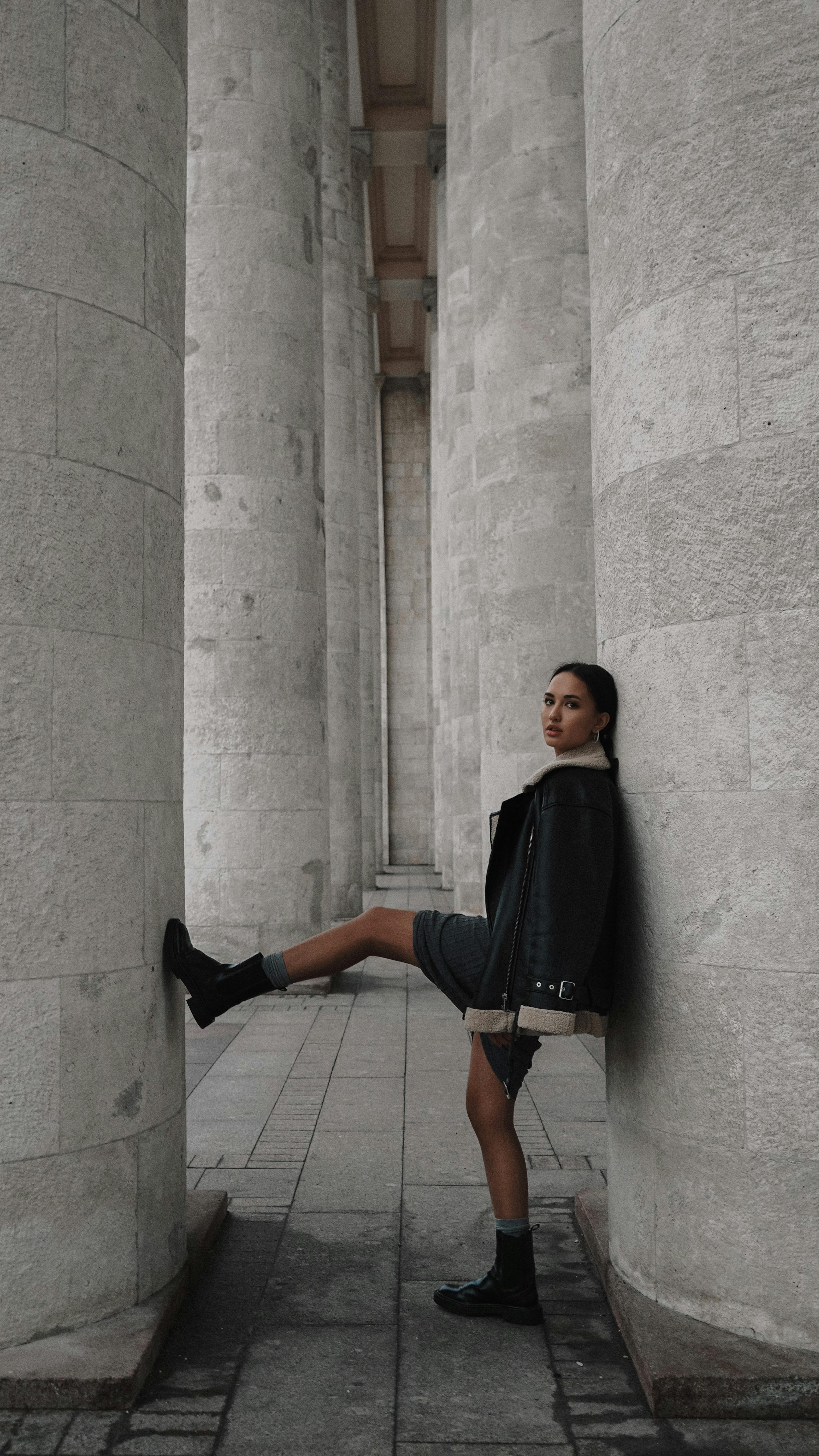 Woman Posing Among Columns · Free Stock Photo