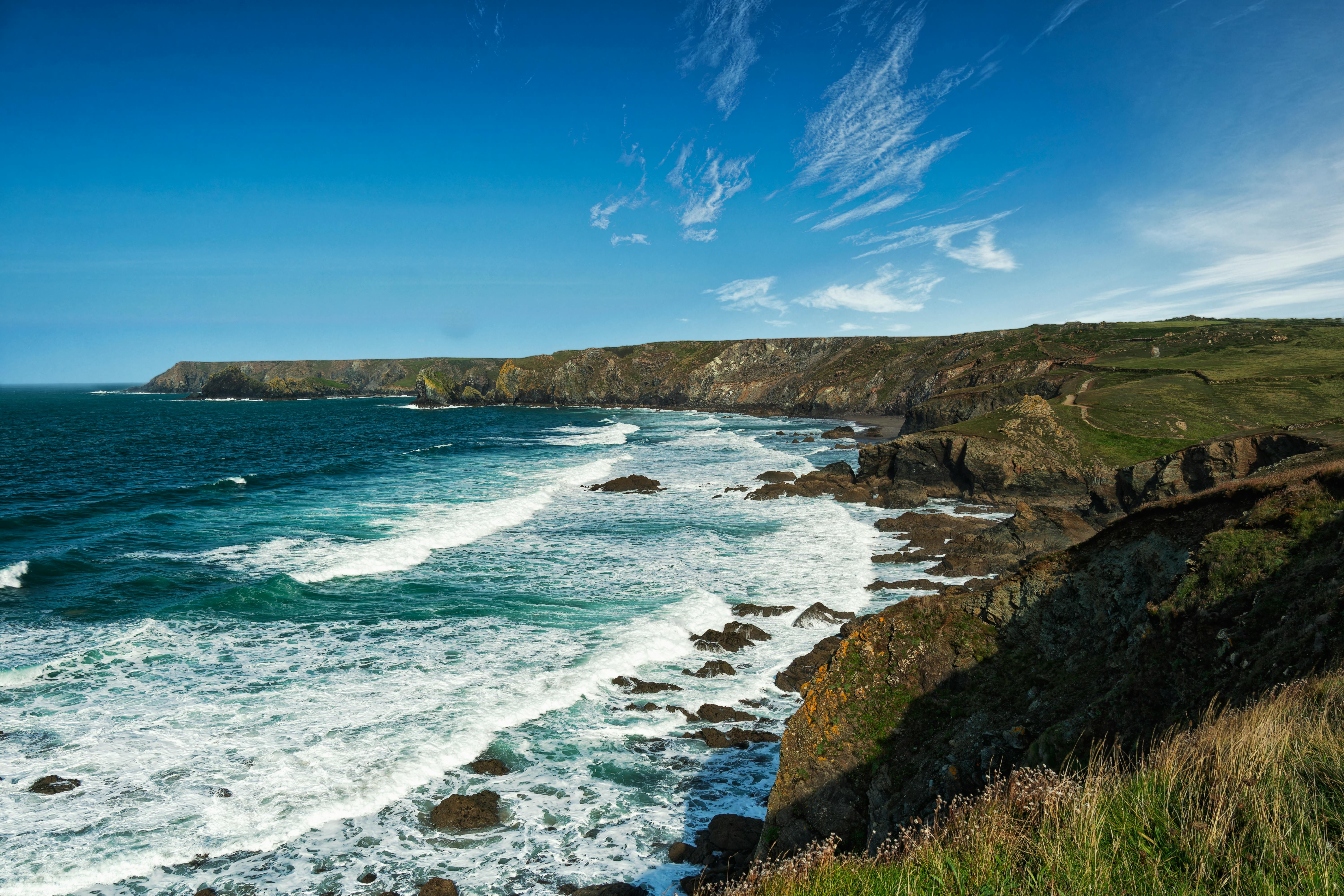 Rocks in Water Near Beach on Seashore · Free Stock Photo