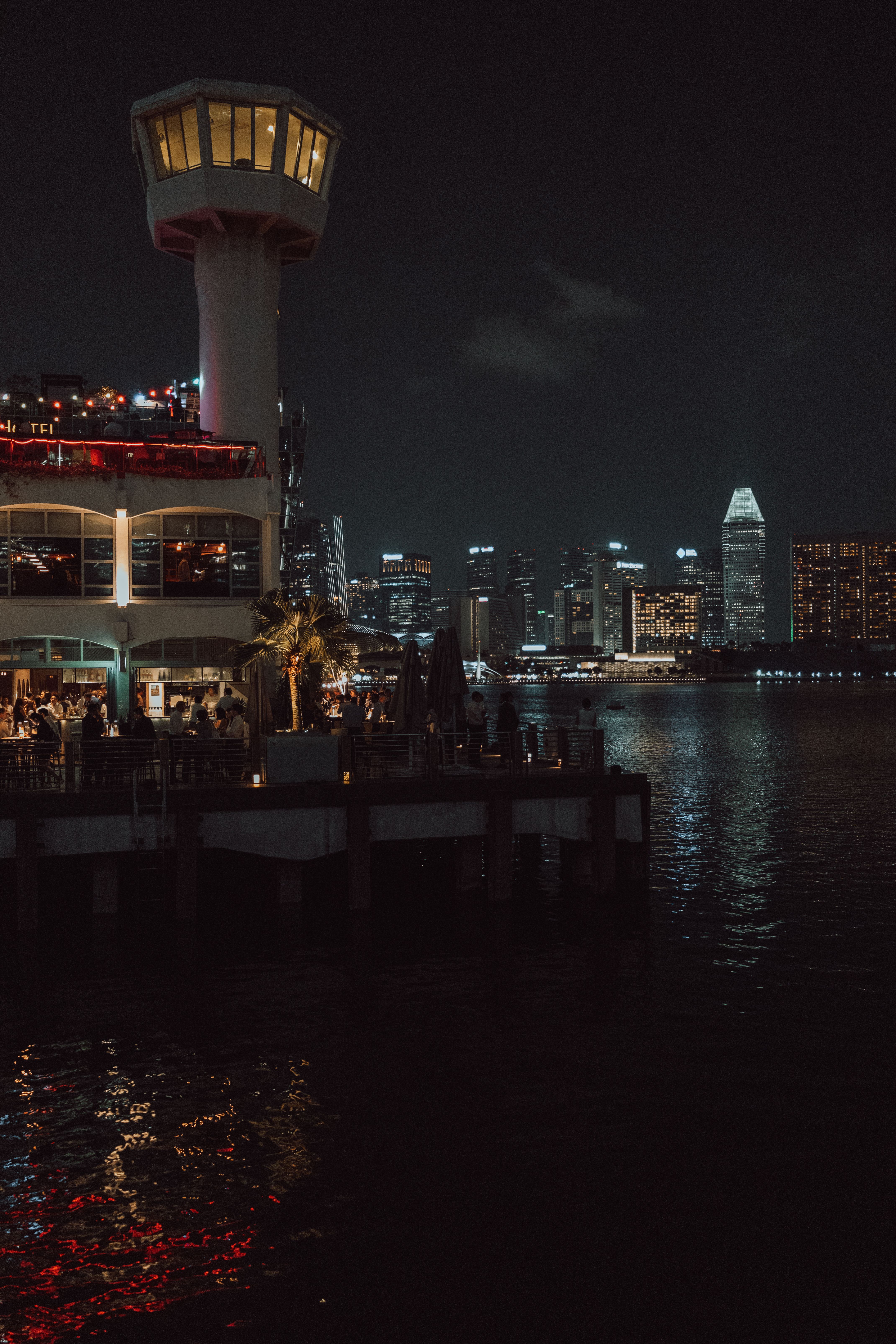 Singapore Harbor with Lighthouse at Night · Free Stock Photo