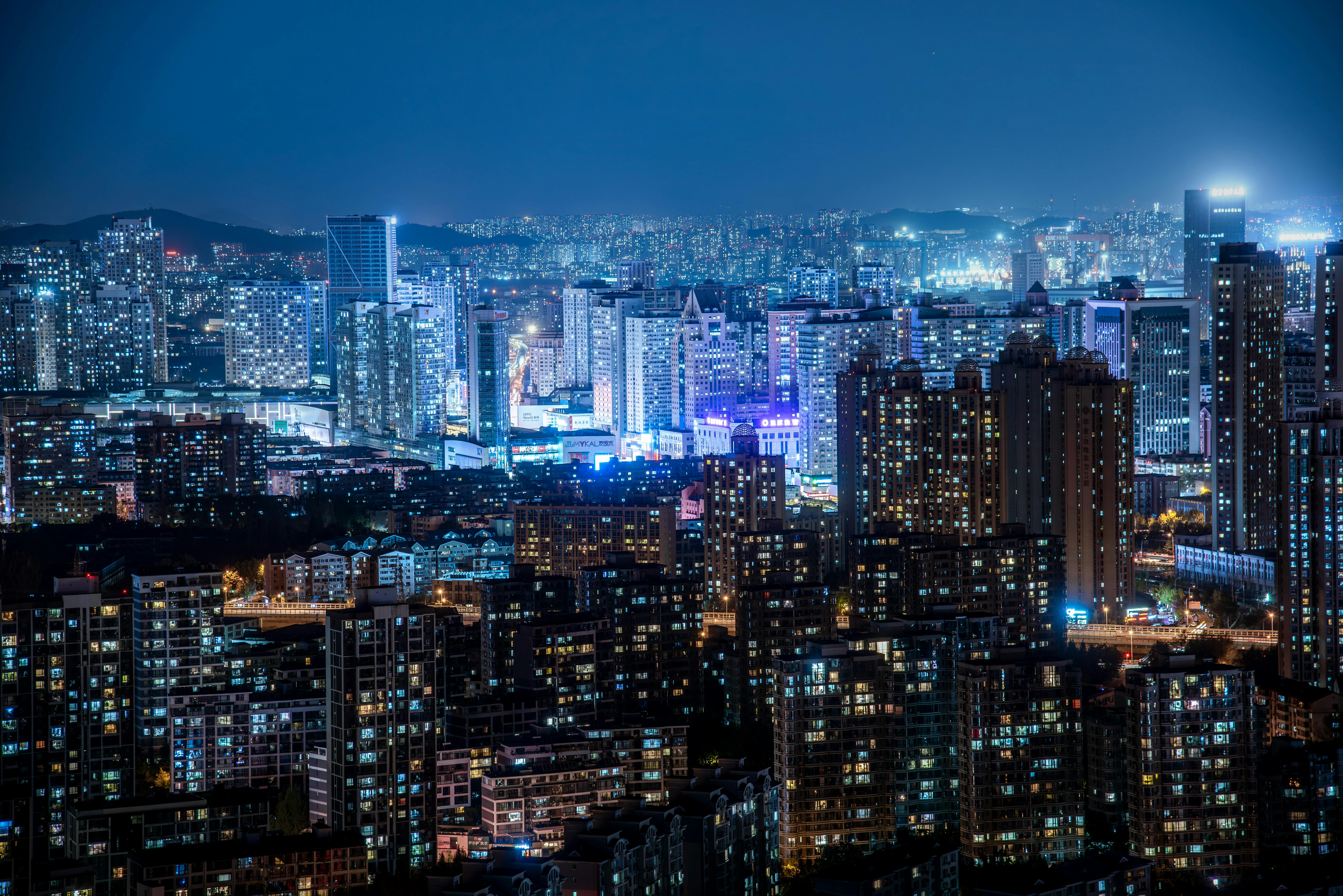 Aerial View of City With High Rise Building at Night Time · Free Stock ...