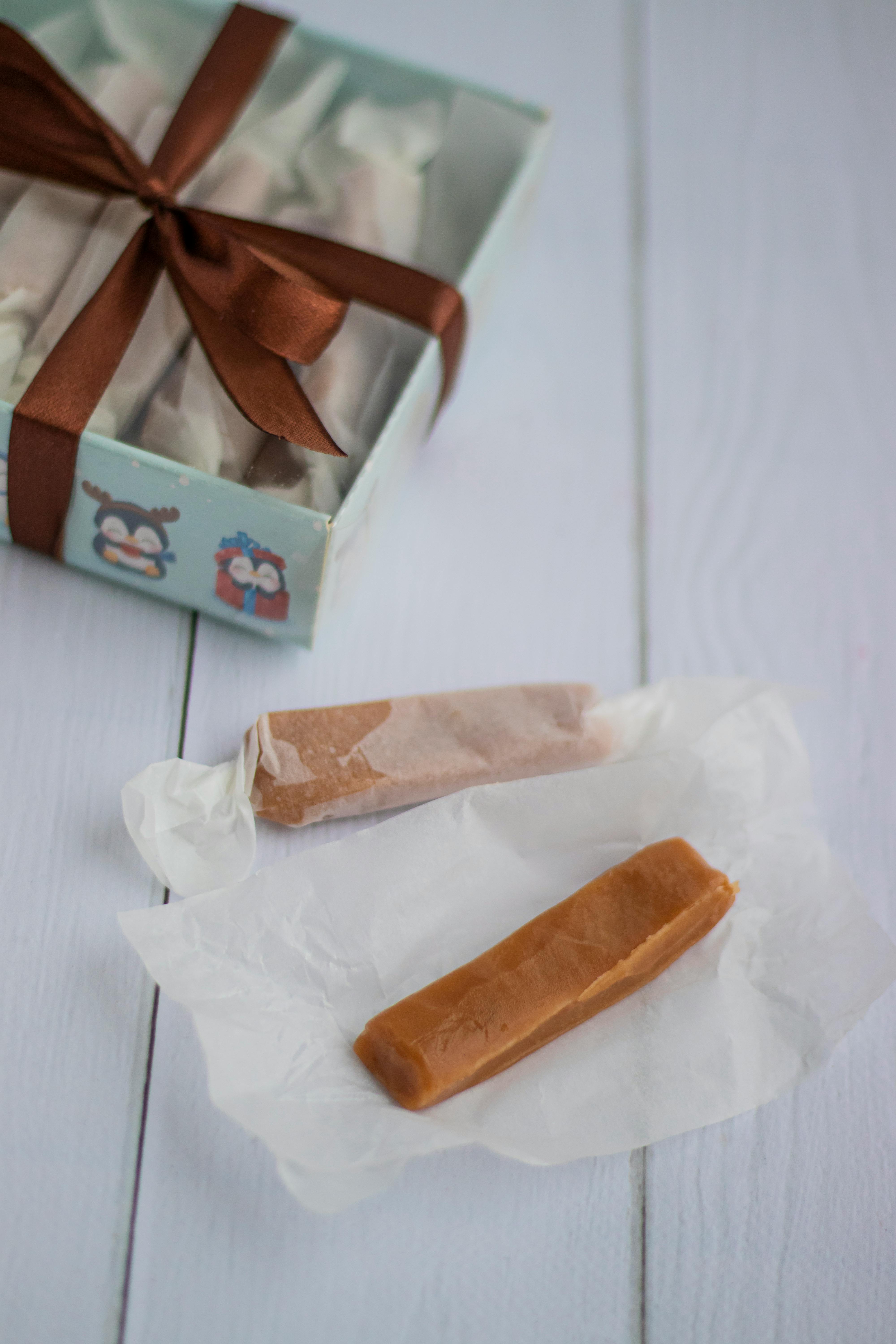 Slim and Long Candies on Paper · Free Stock Photo