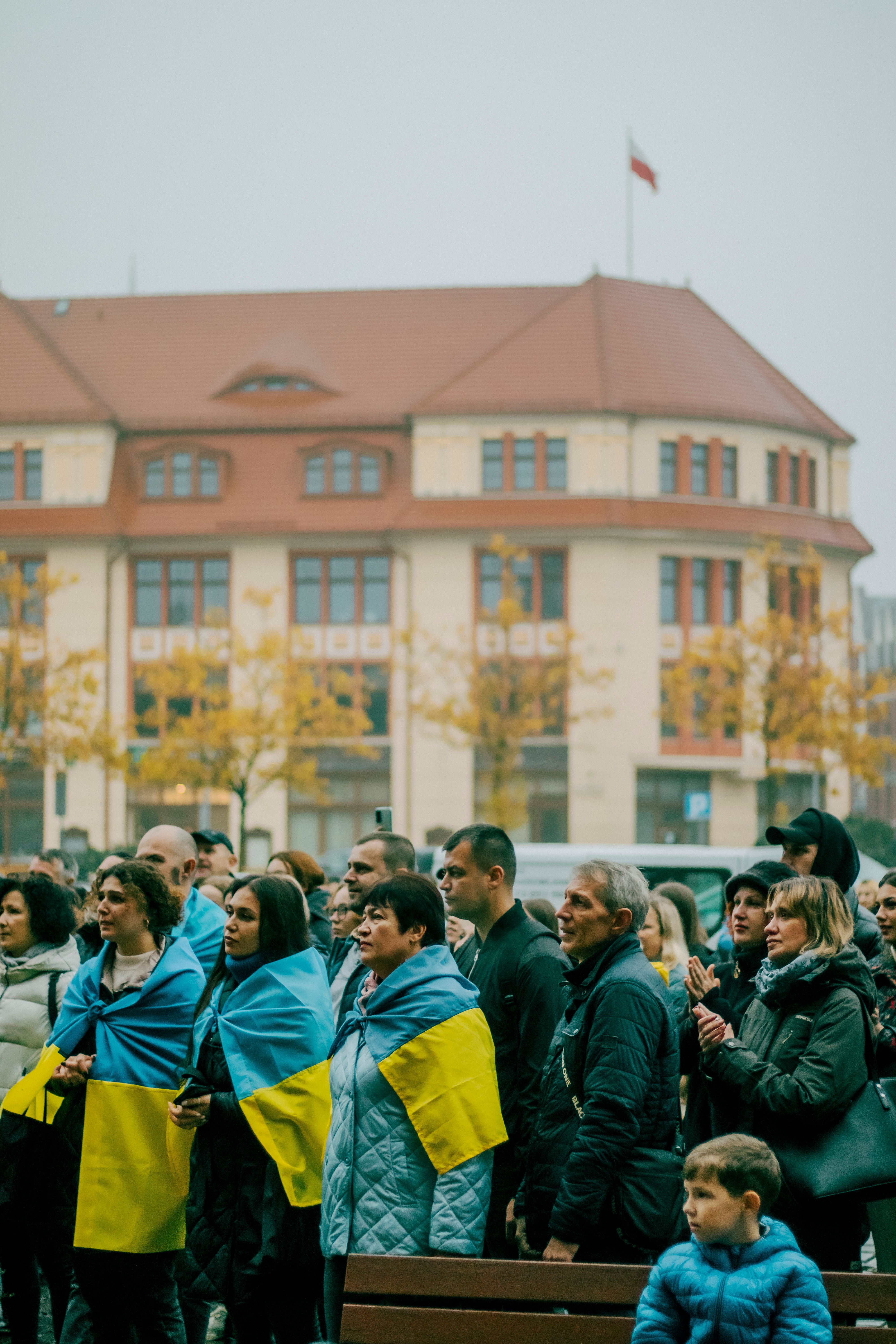 People Wearing Ukrainian Flags Standing in the Crowd Gathered near a ...