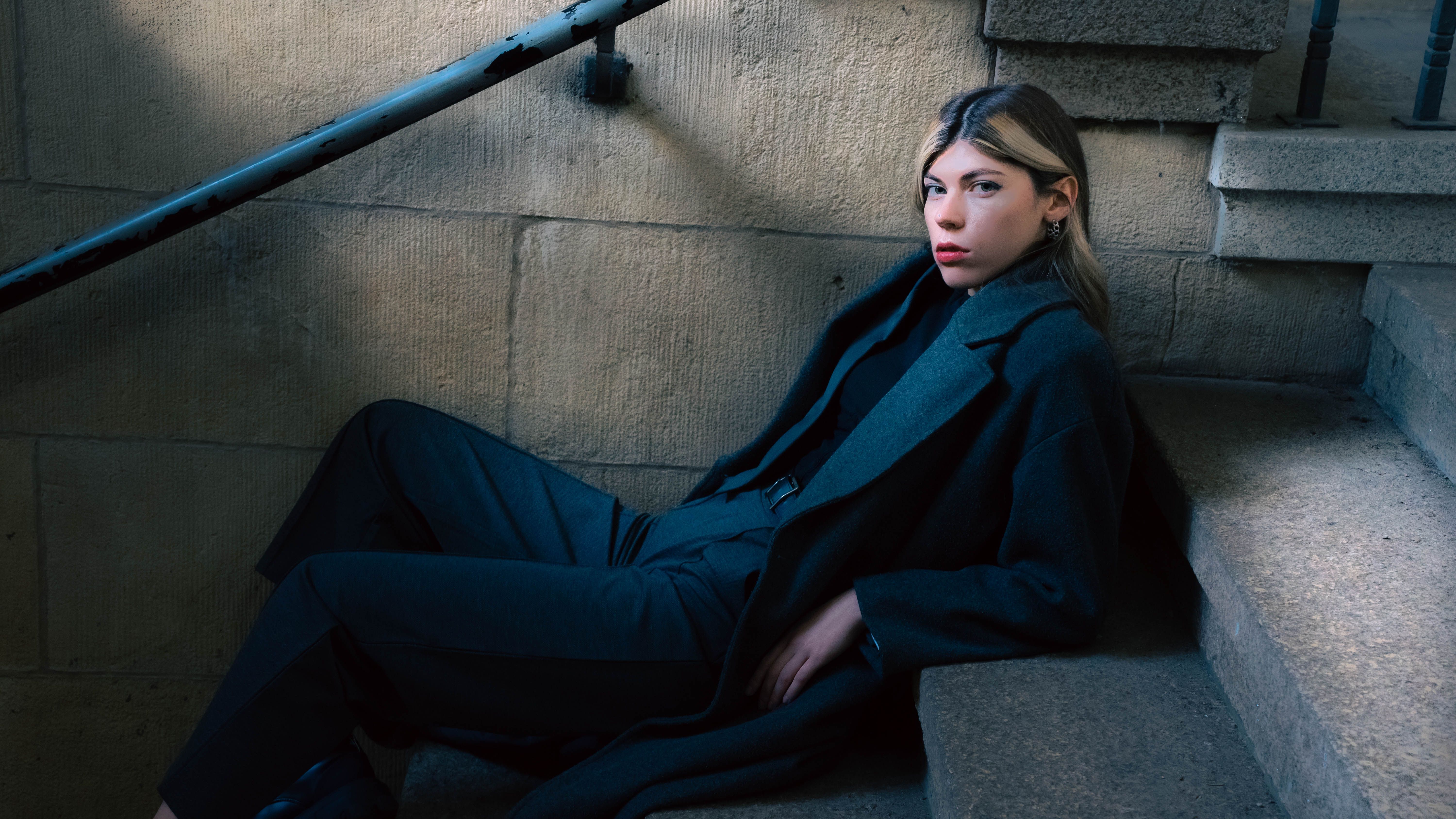 Model in Gray Suit Sitting on Stairs · Free Stock Photo