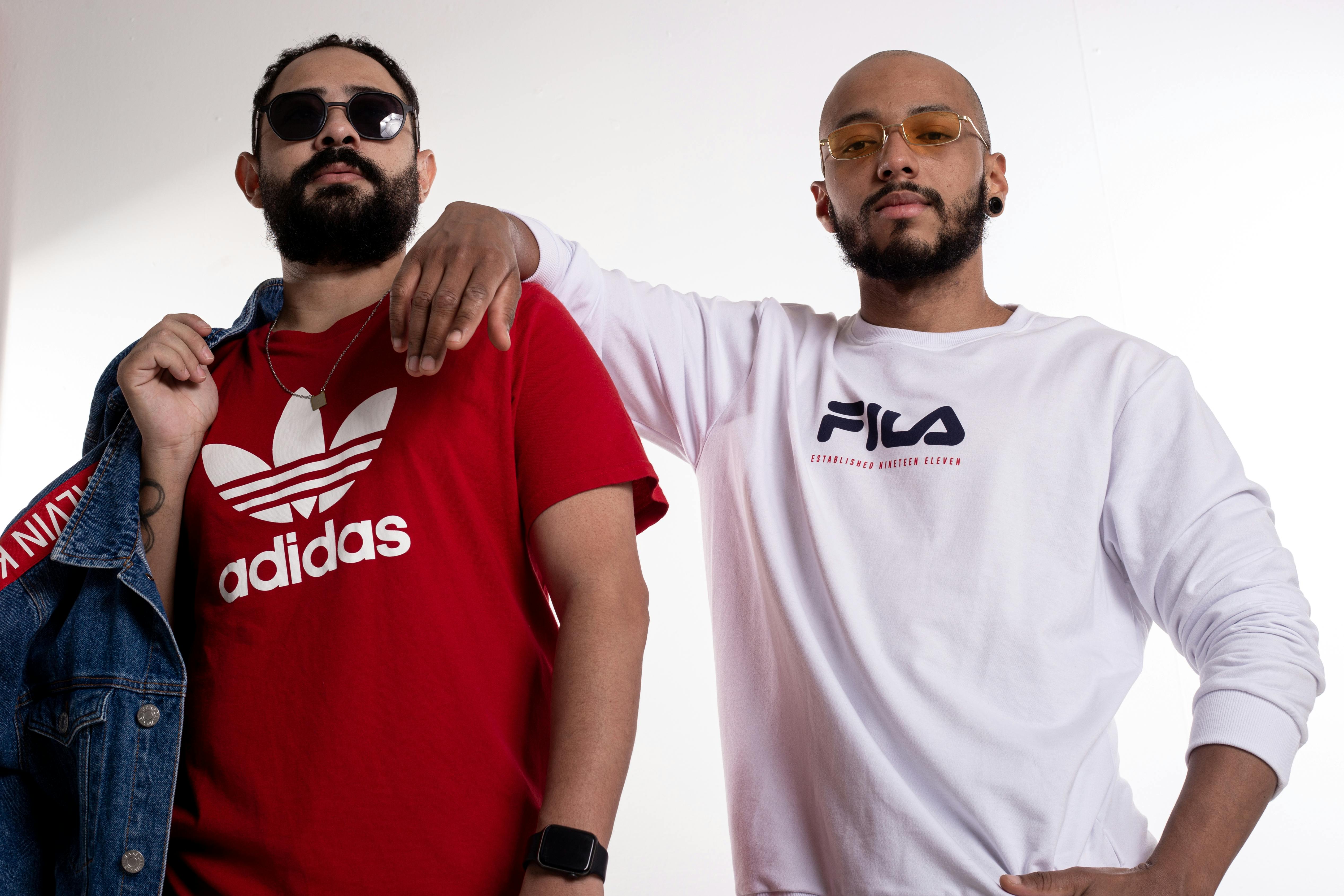 Two Men in Casual Outfits Posing in Studio · Free Stock Photo