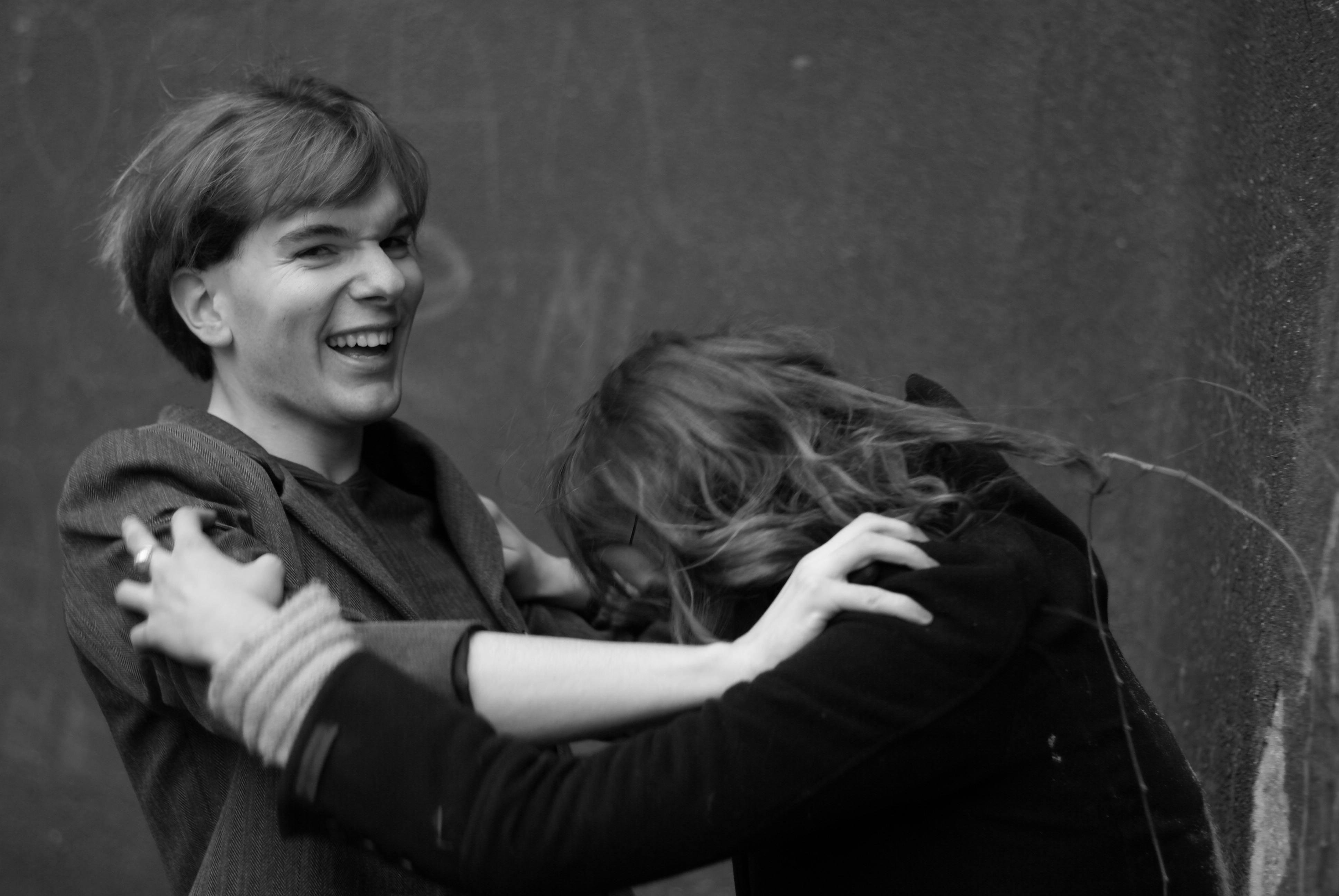 Two people hugging each other in black and white · Free Stock Photo