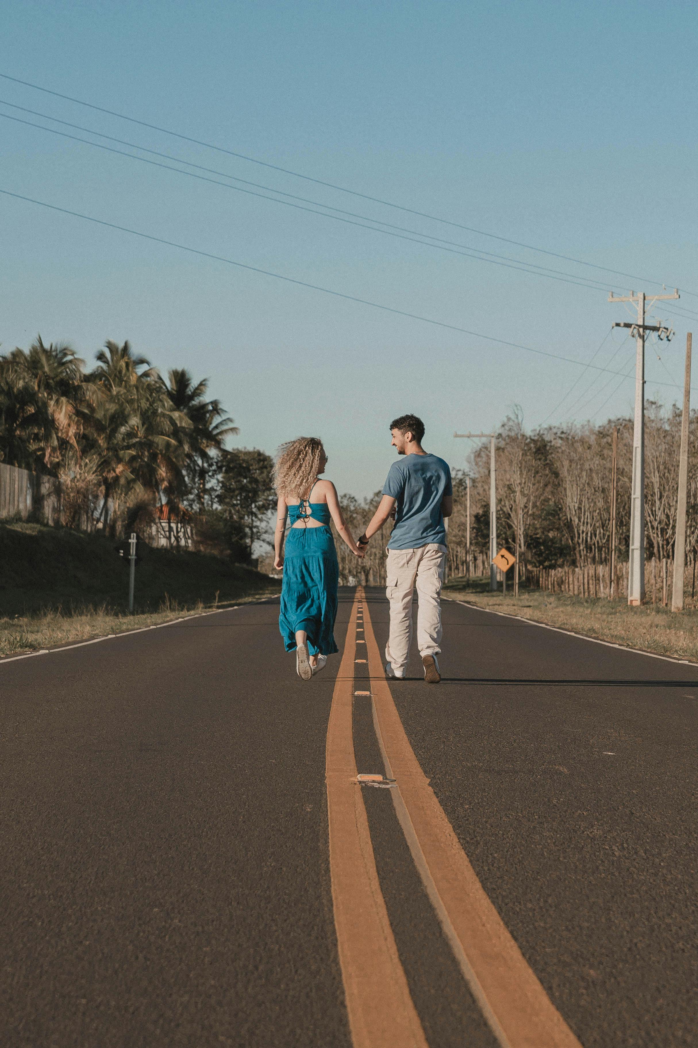 Couple Walking Together on Road · Free Stock Photo