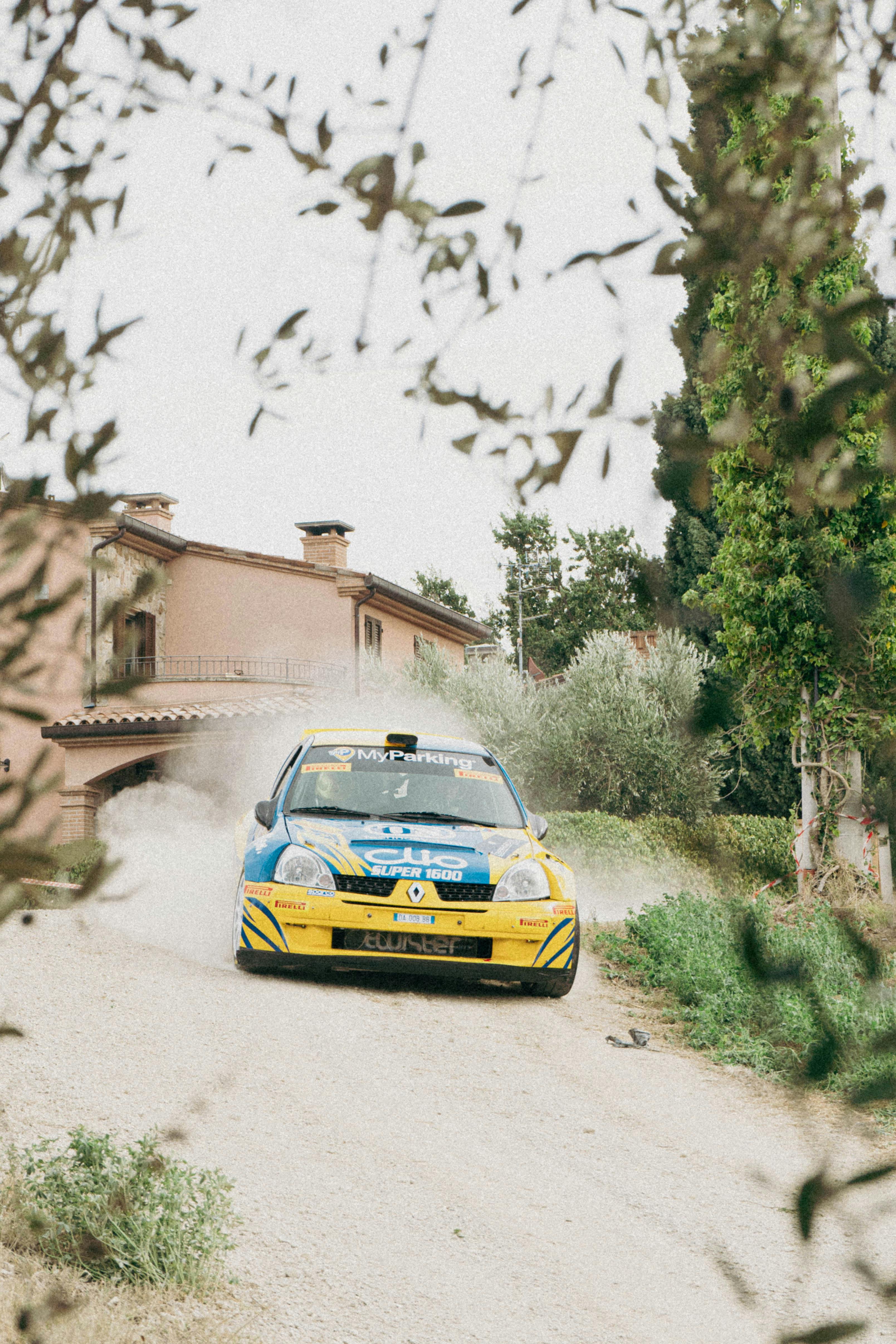 Rally Renault Clio on Dirt Road · Free Stock Photo