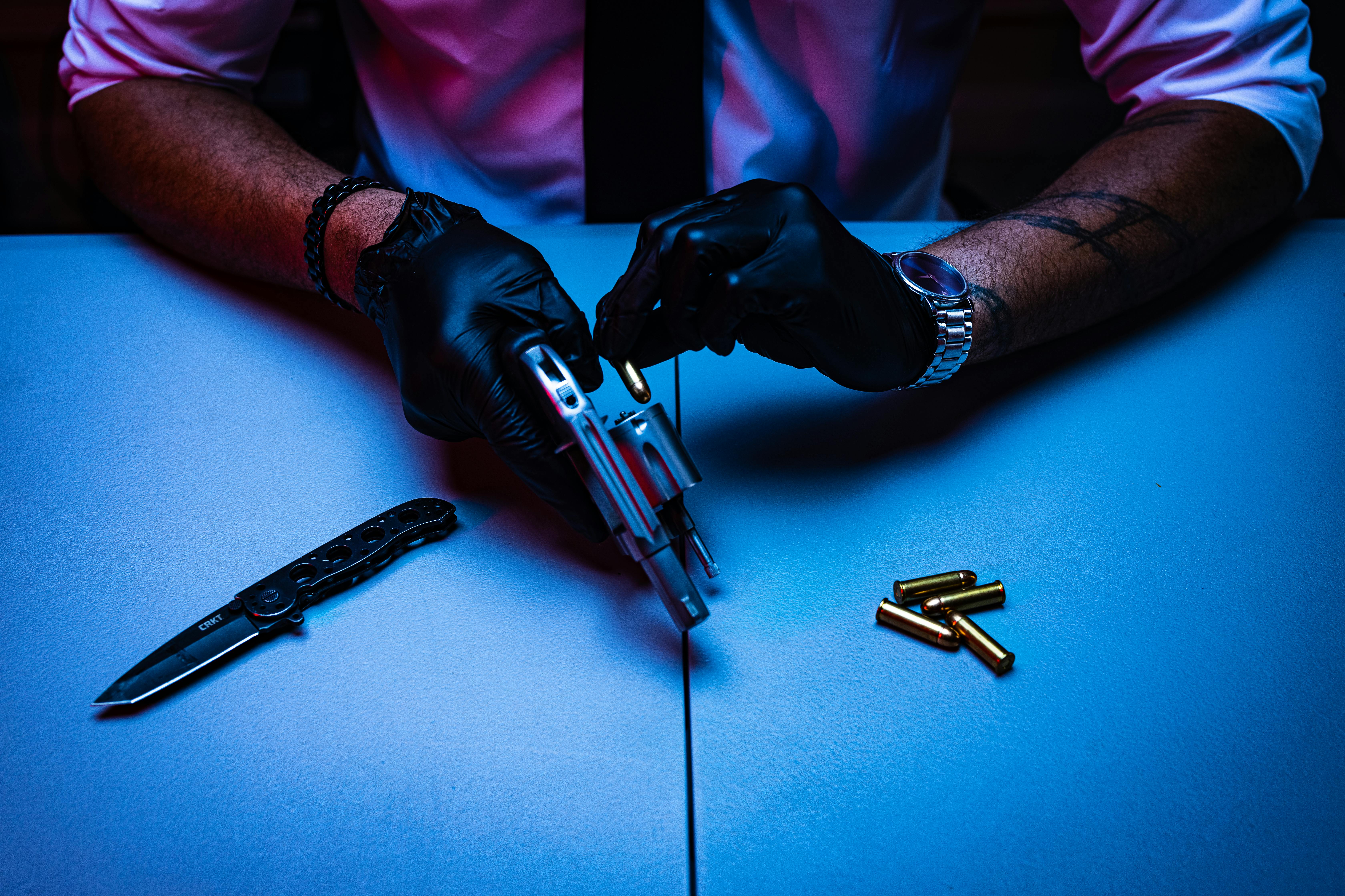 Man Hands Reloading Revolver · Free Stock Photo