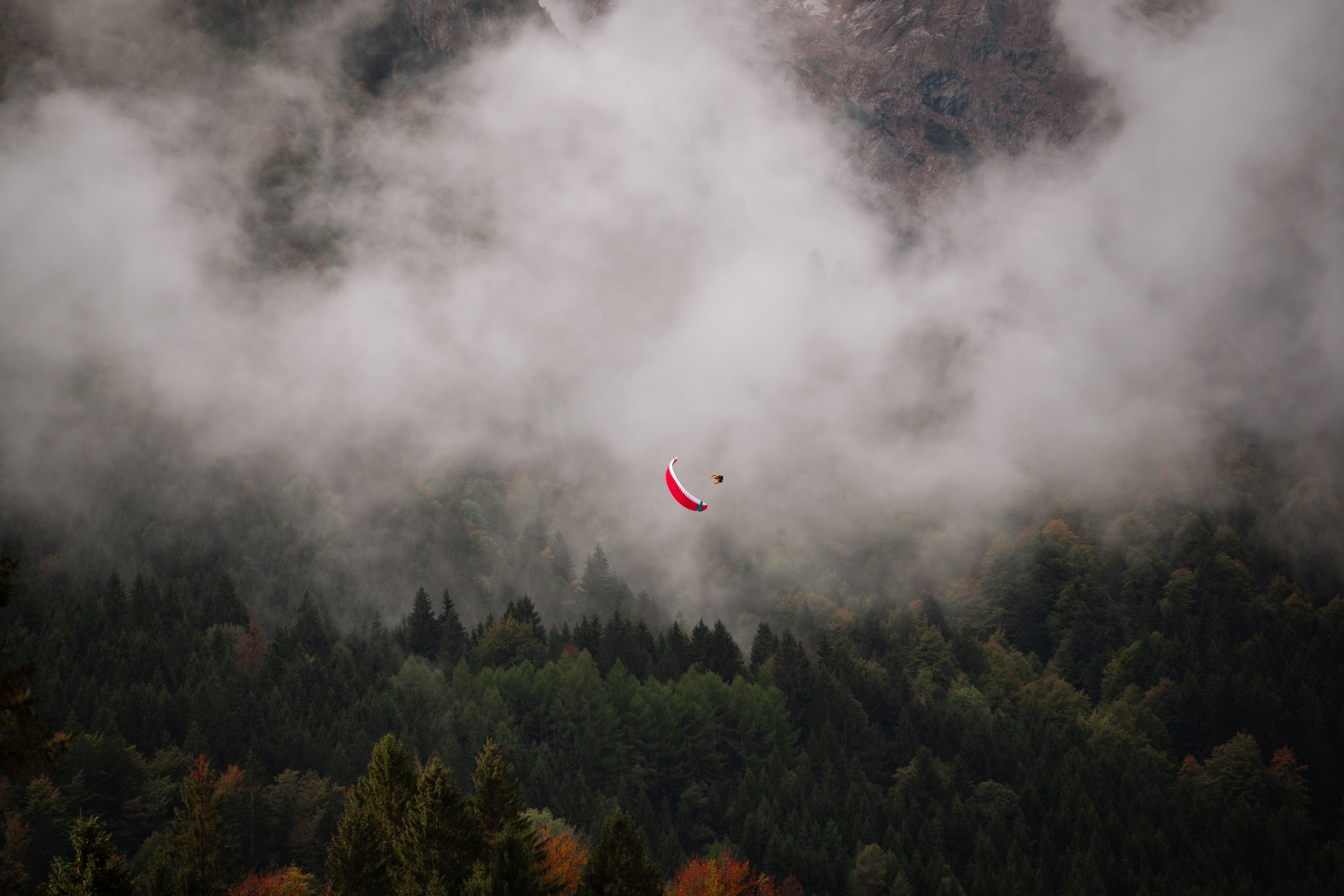 Aerial View of a Parachute over an Autumnal Forest · Free Stock Photo
