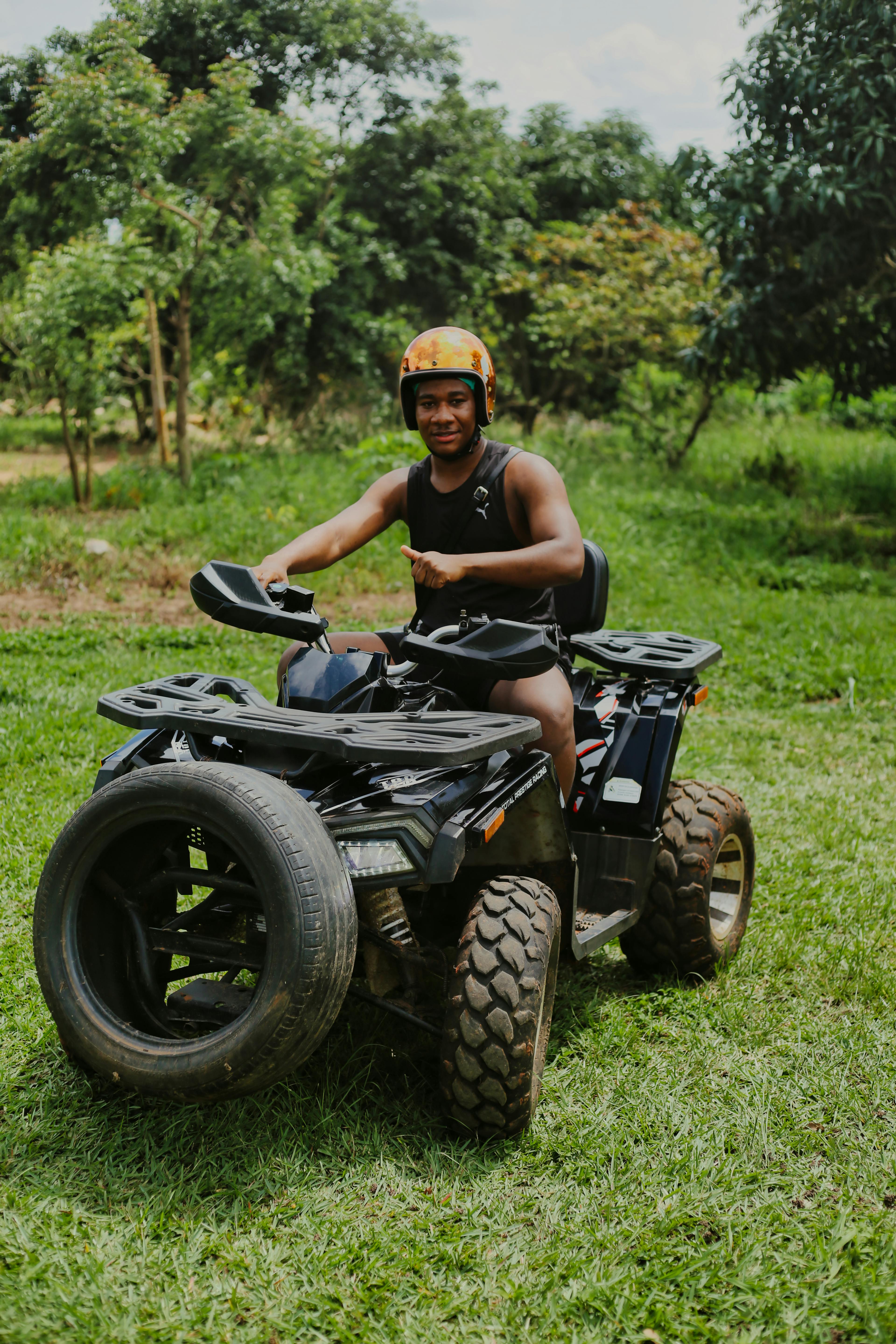 Woman Sitting on a Quad Bike · Free Stock Photo