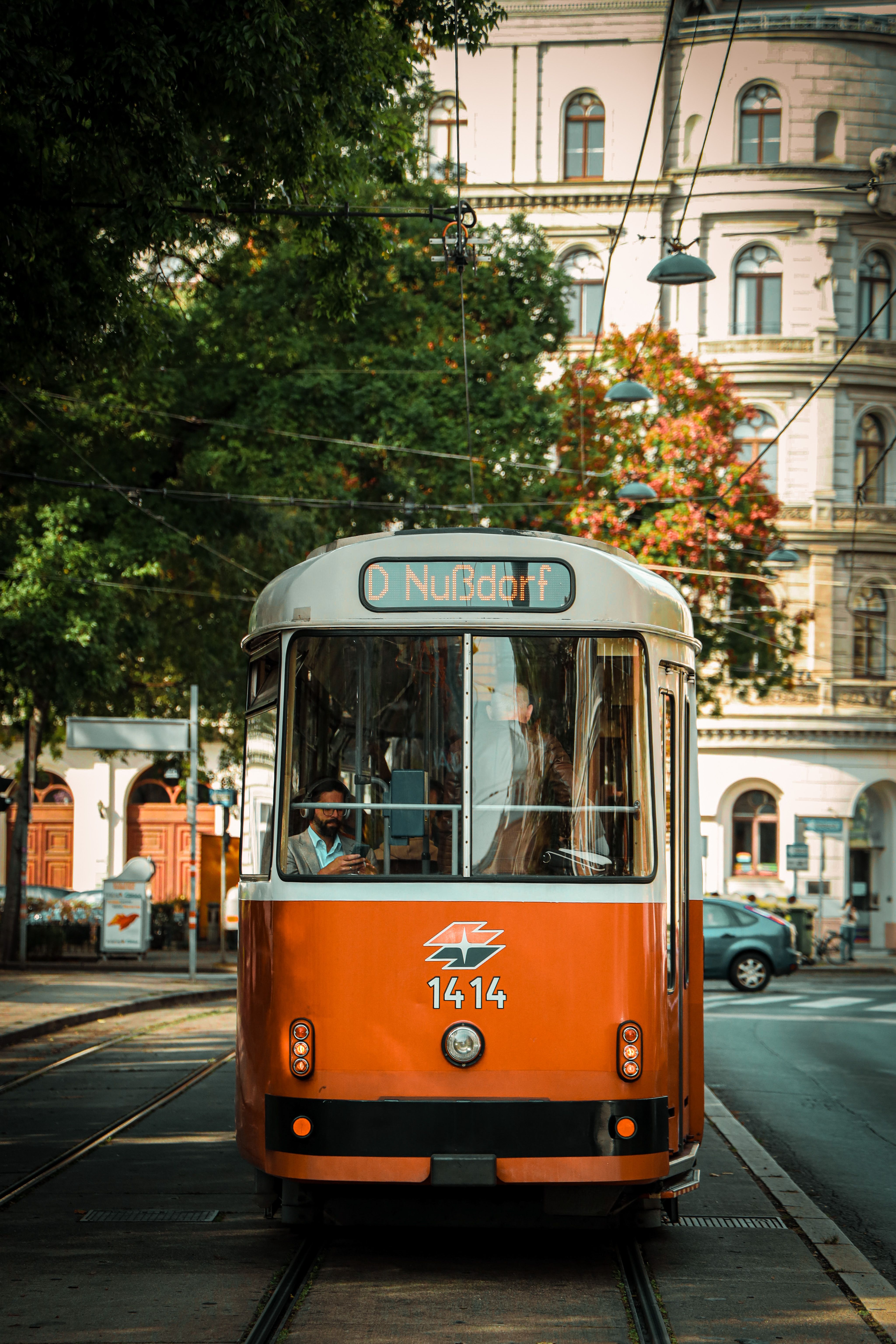 Red Tram in a City Center · Free Stock Photo