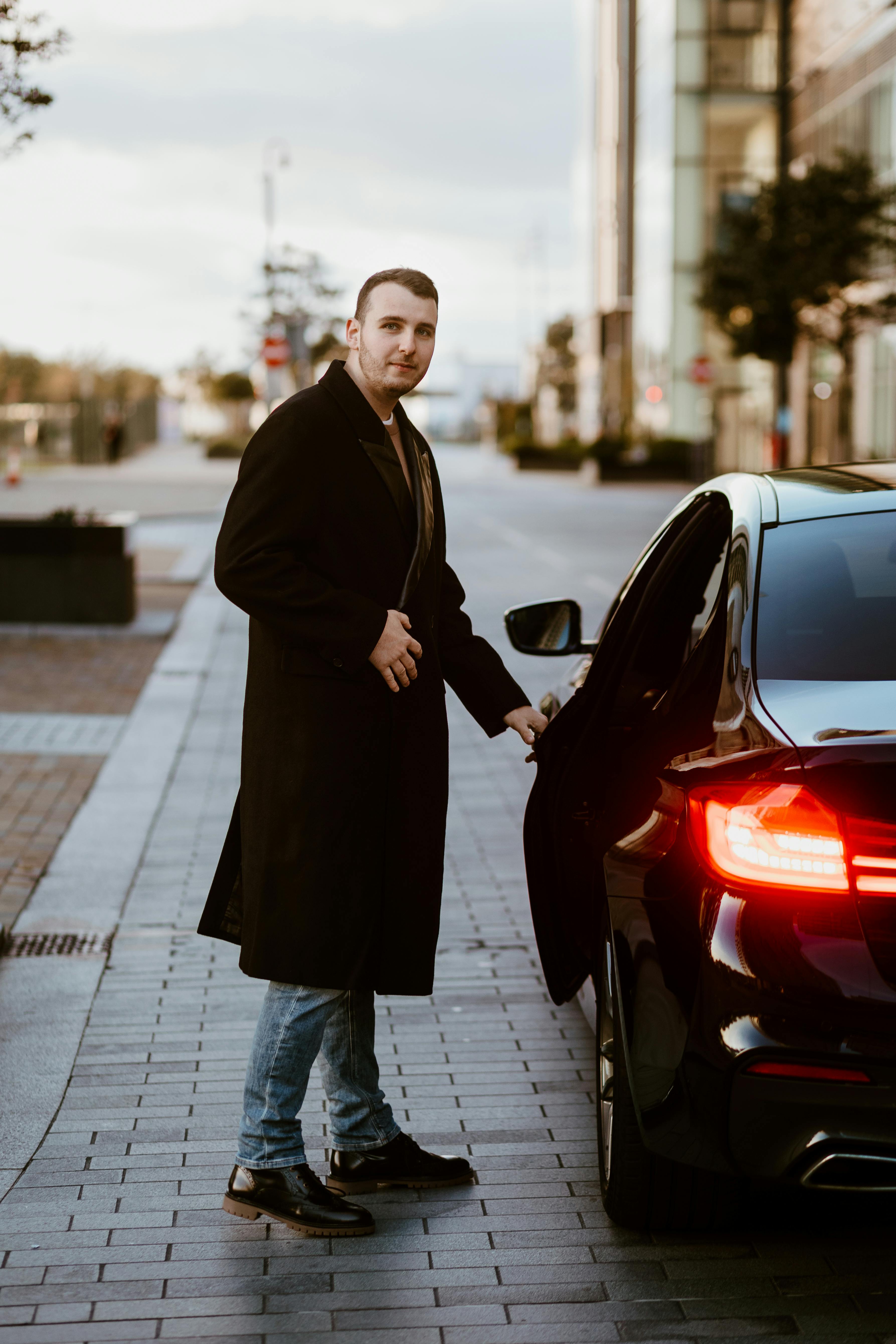 Elegant Man Getting Into a Car · Free Stock Photo