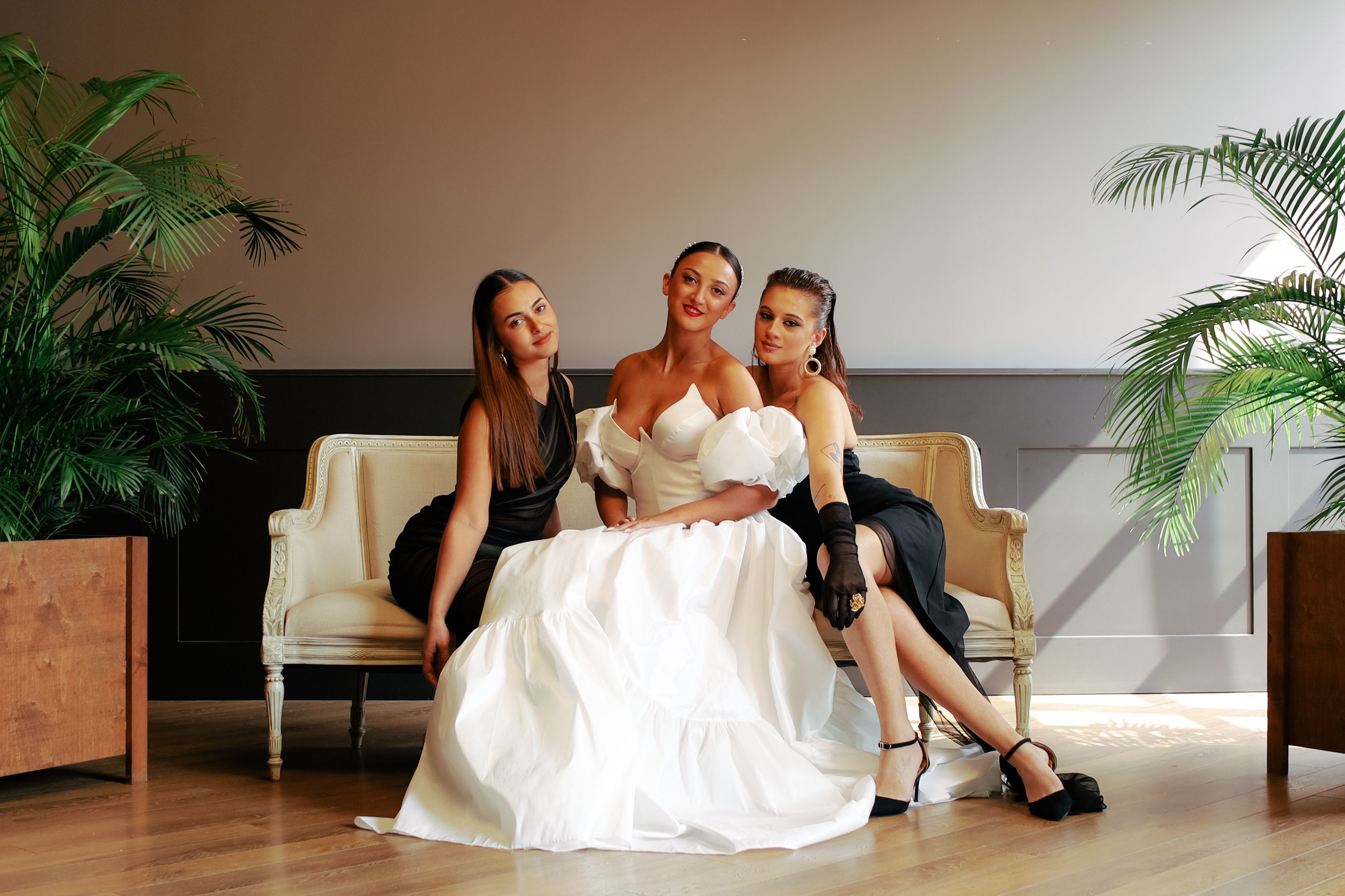 Bride Sitting on Sofa with Bridesmaids · Free Stock Photo