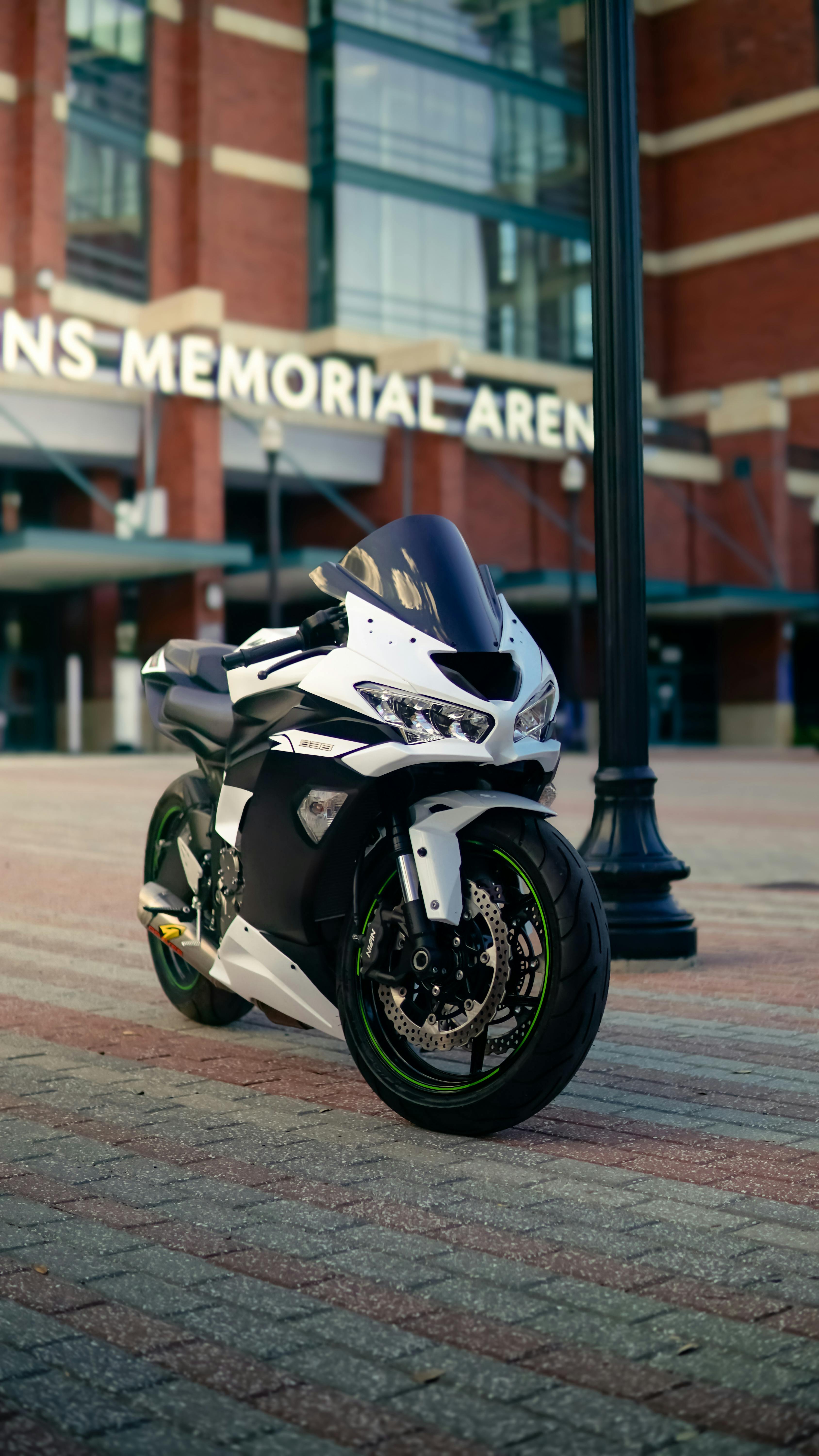 Racing Motorcycle Parked in front of a Building · Free Stock Photo