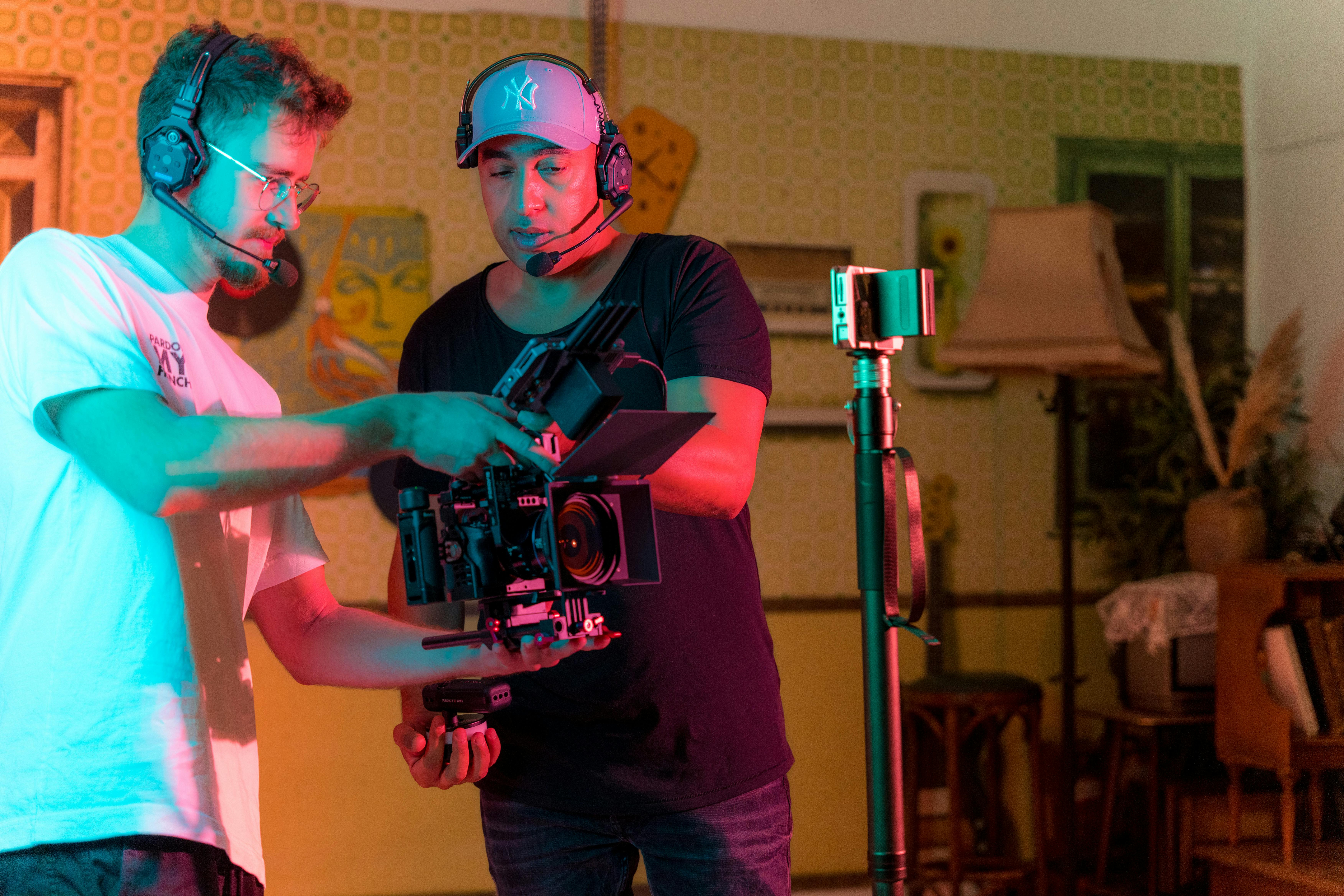 Men Operating Cameras · Free Stock Photo