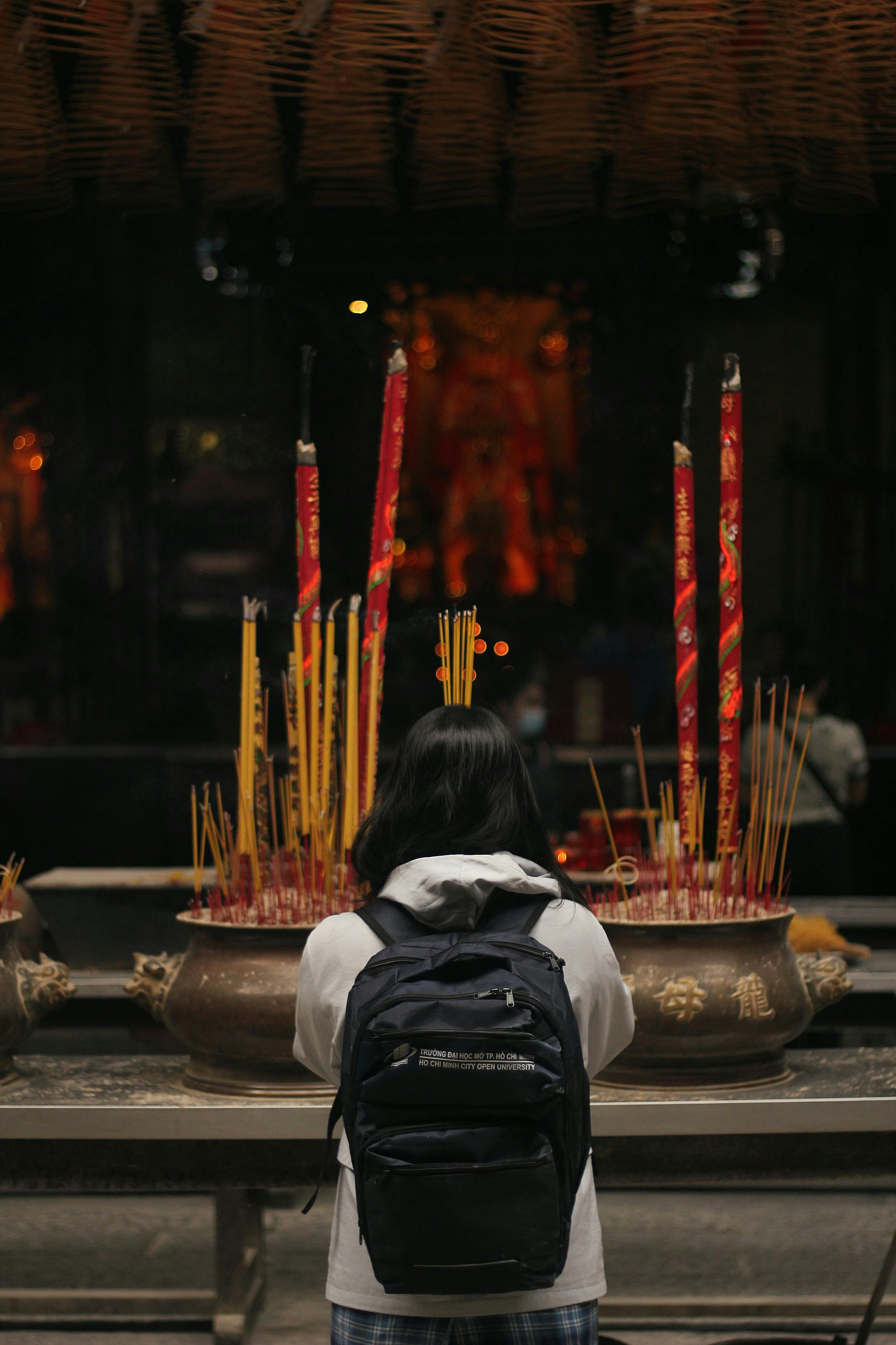 Lighting of an Incense Stick by a Person · Free Stock Photo