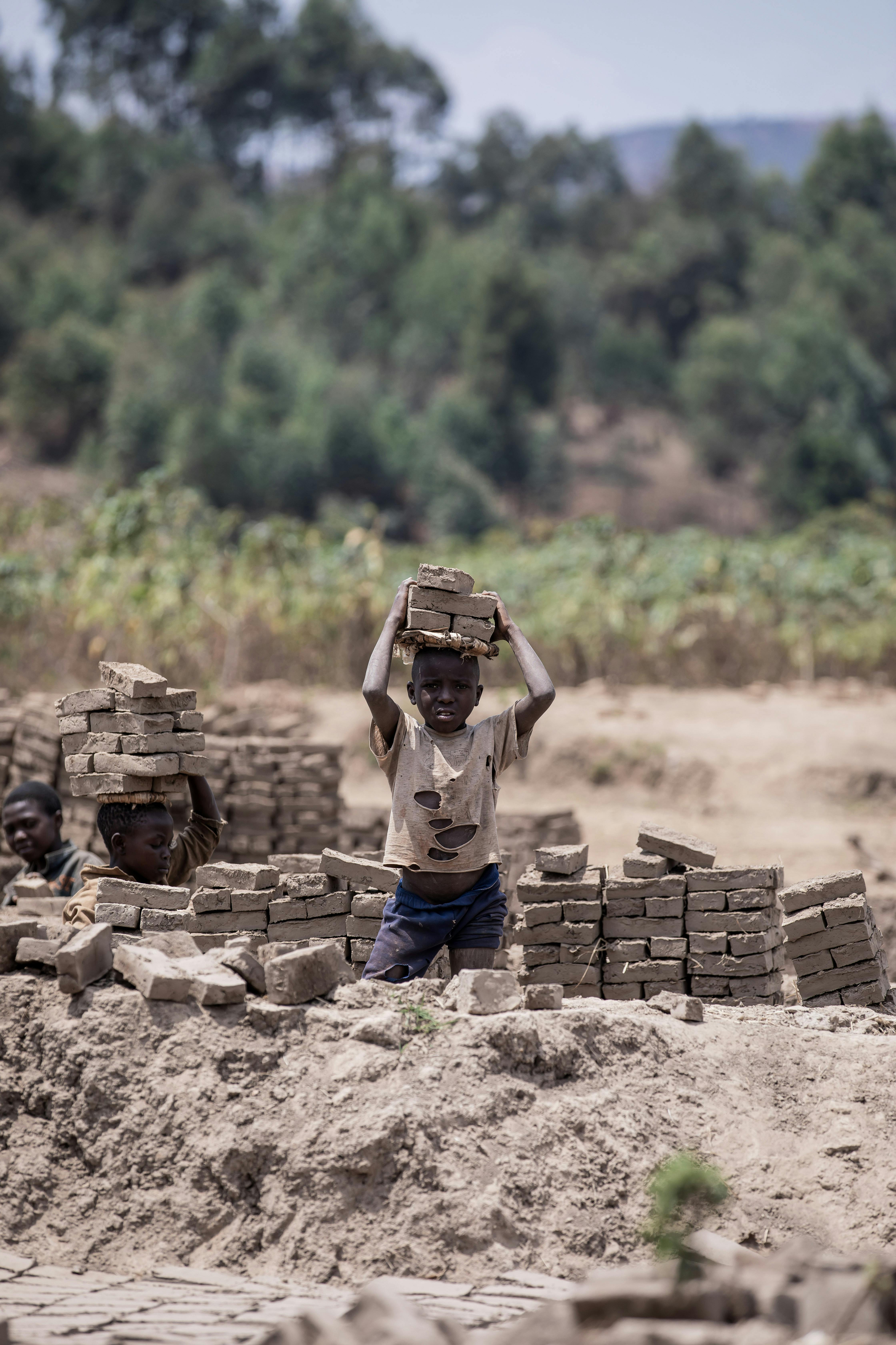 African Boy Working on Desert · Free Stock Photo