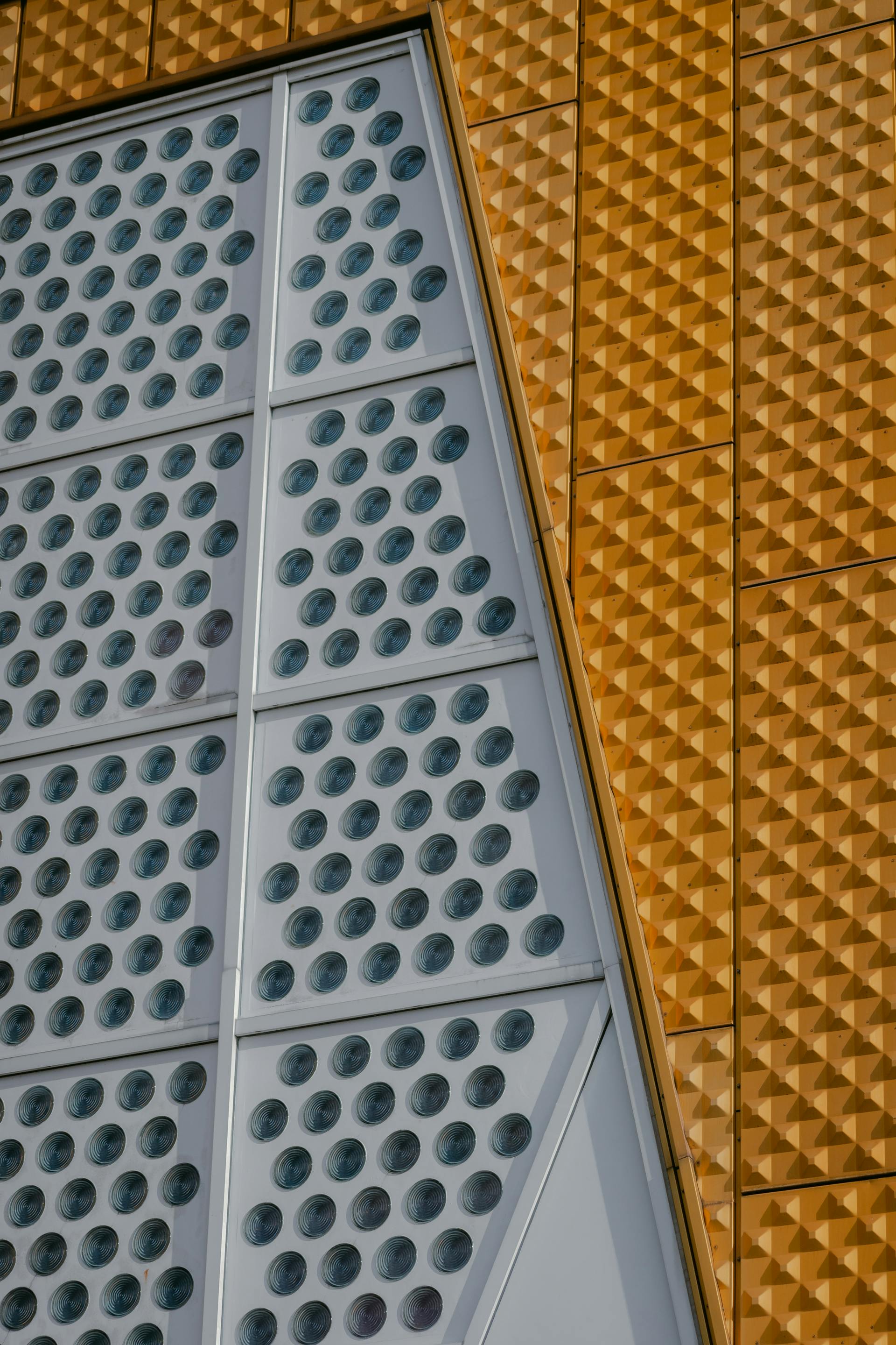 Low Angle Photo of a Red Textured Building Exterior · Free Stock Photo