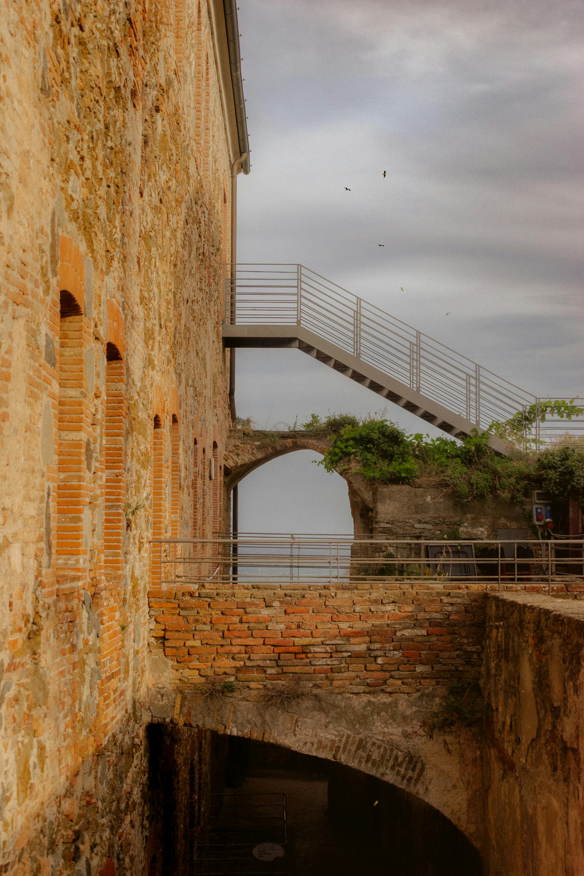 Footbridge by Stairs at Old Brick Building in Italy · Free Stock Photo