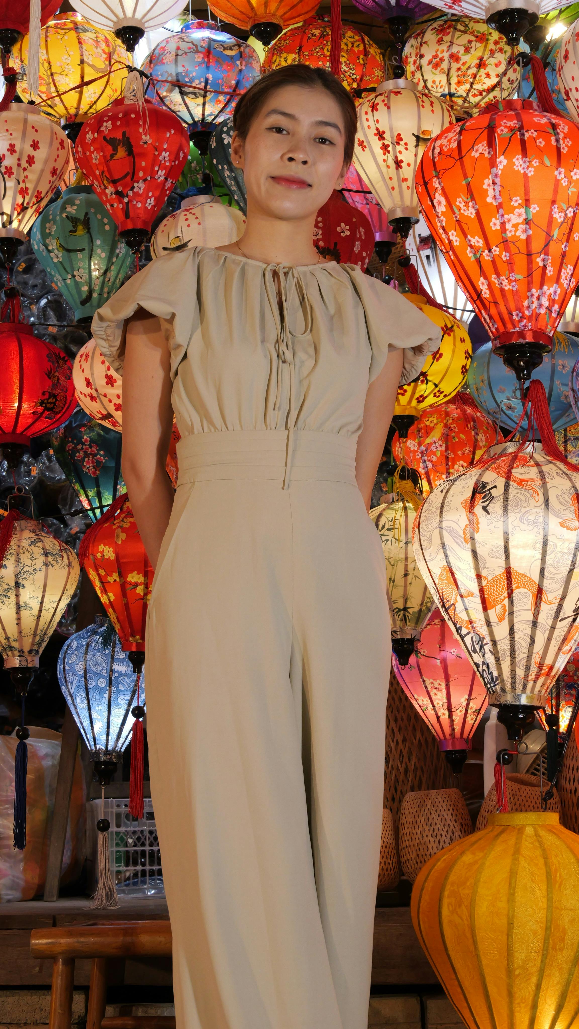 Portrait of a Woman in Front of Lanterns · Free Stock Photo