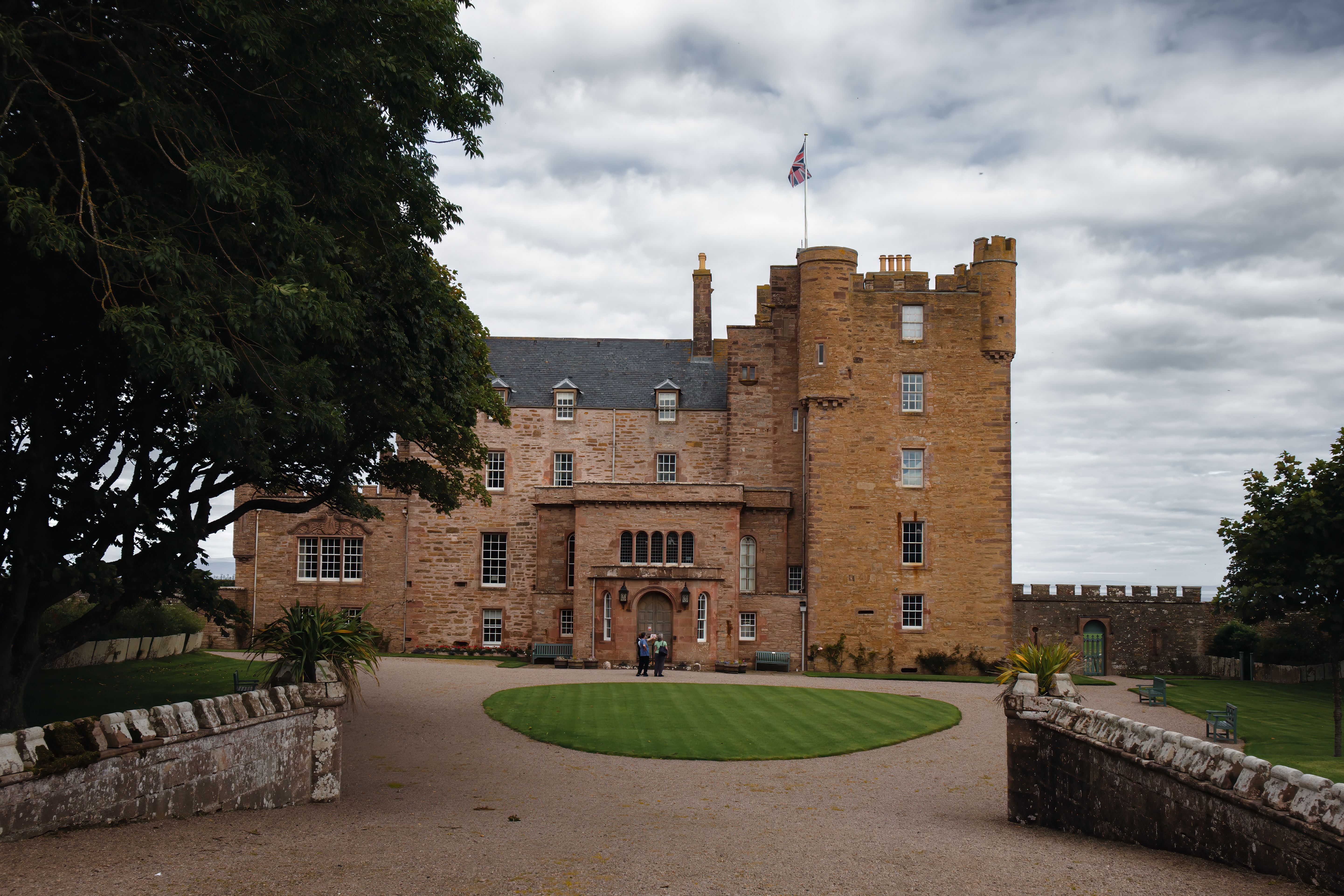 Stone Castle With Green Grass Front Yard · Free Stock Photo