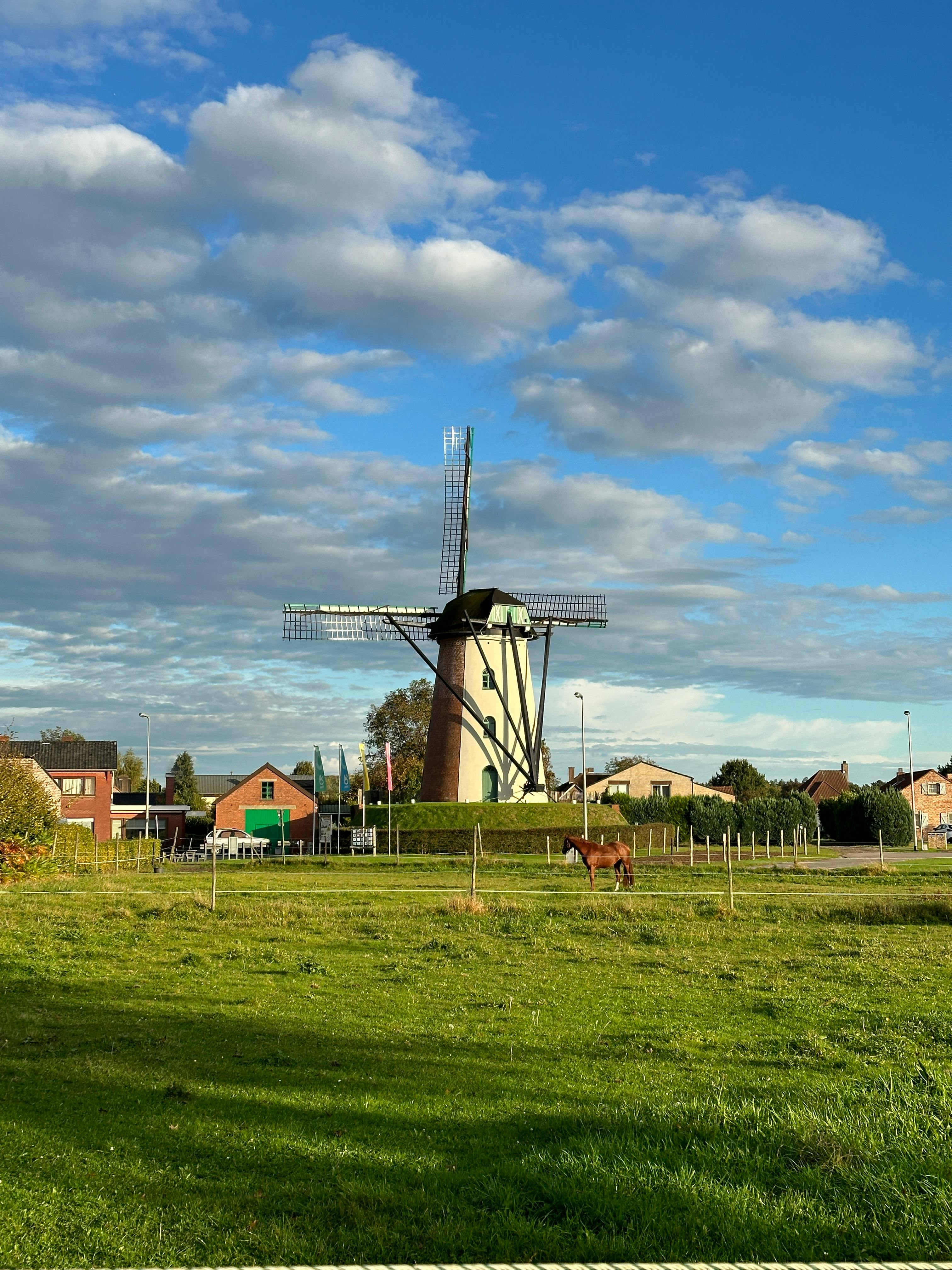 Rural Landscape with an Old Windmill at a Farm · Free Stock Photo