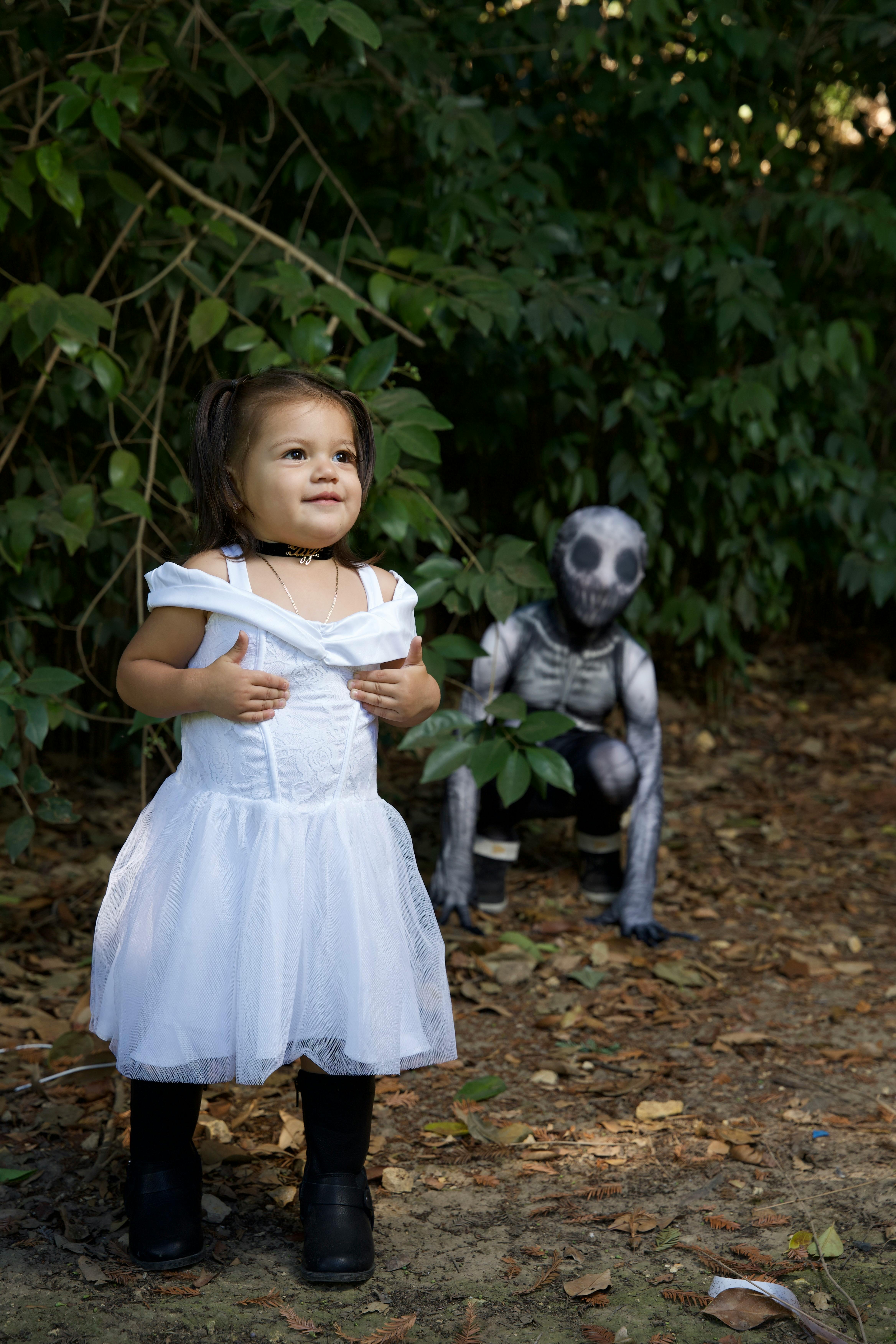 Little Girl in Costume in a Forest · Free Stock Photo