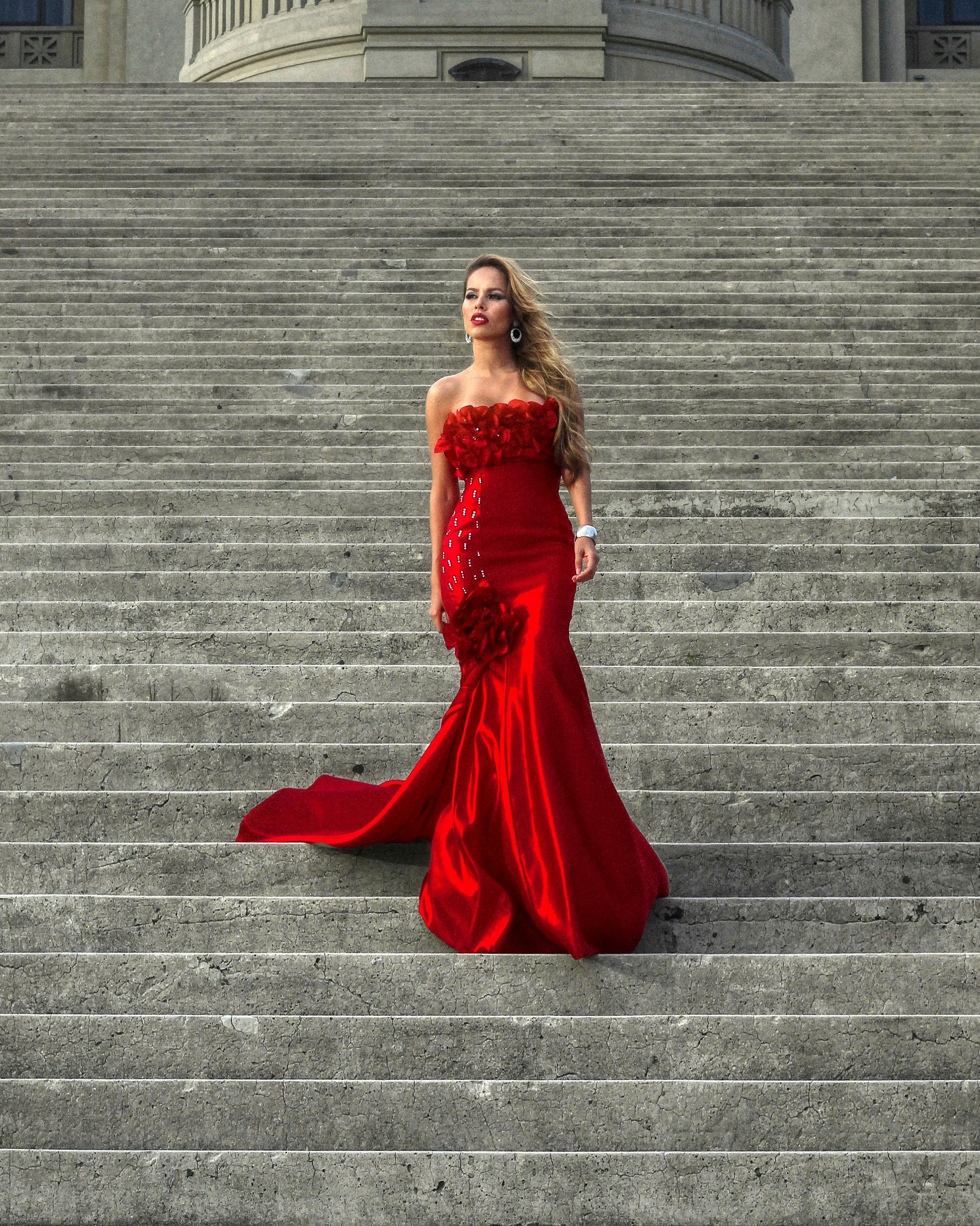 Model in Red Dress on Stairs · Free Stock Photo