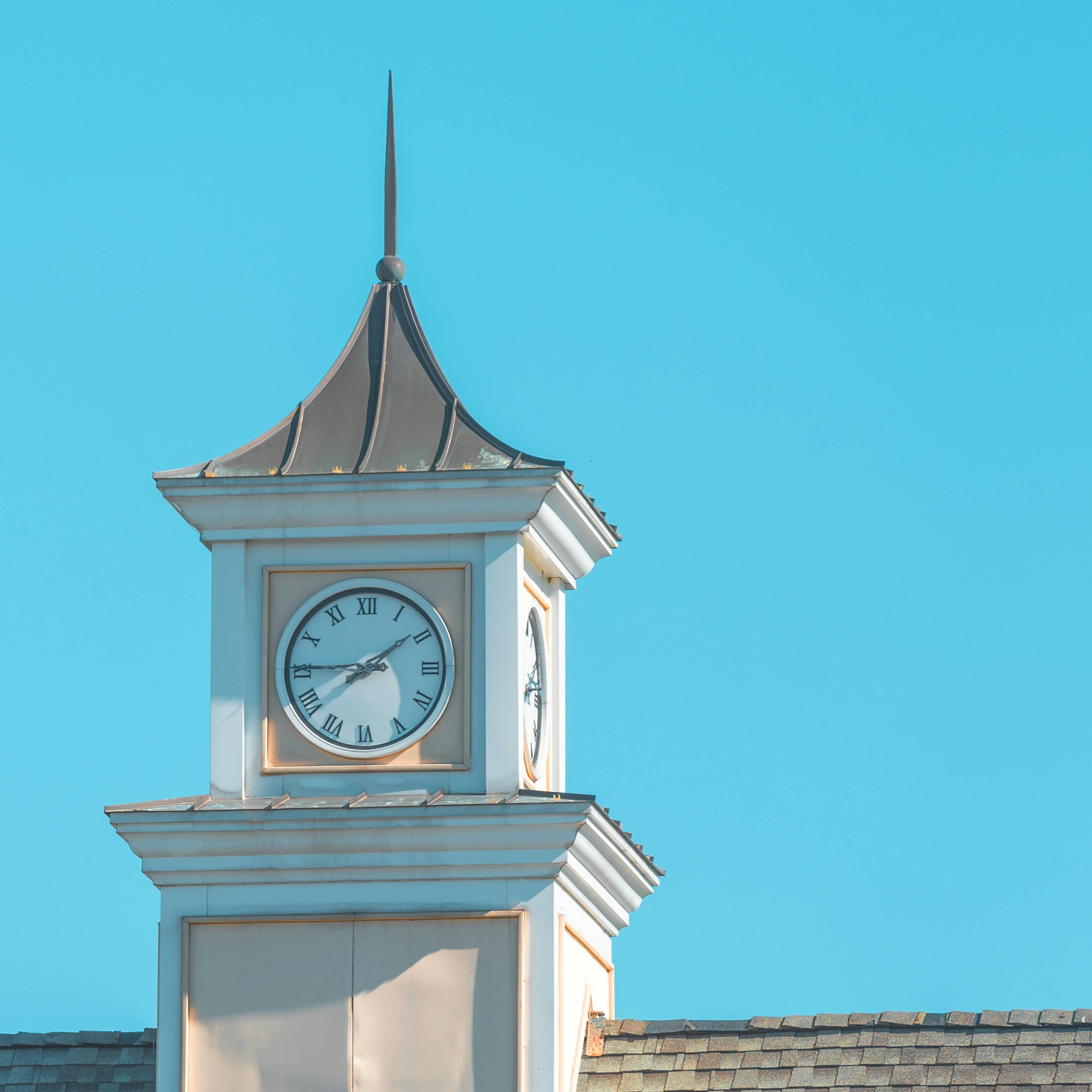Clock Tower against a Clear Blue Sky · Free Stock Photo