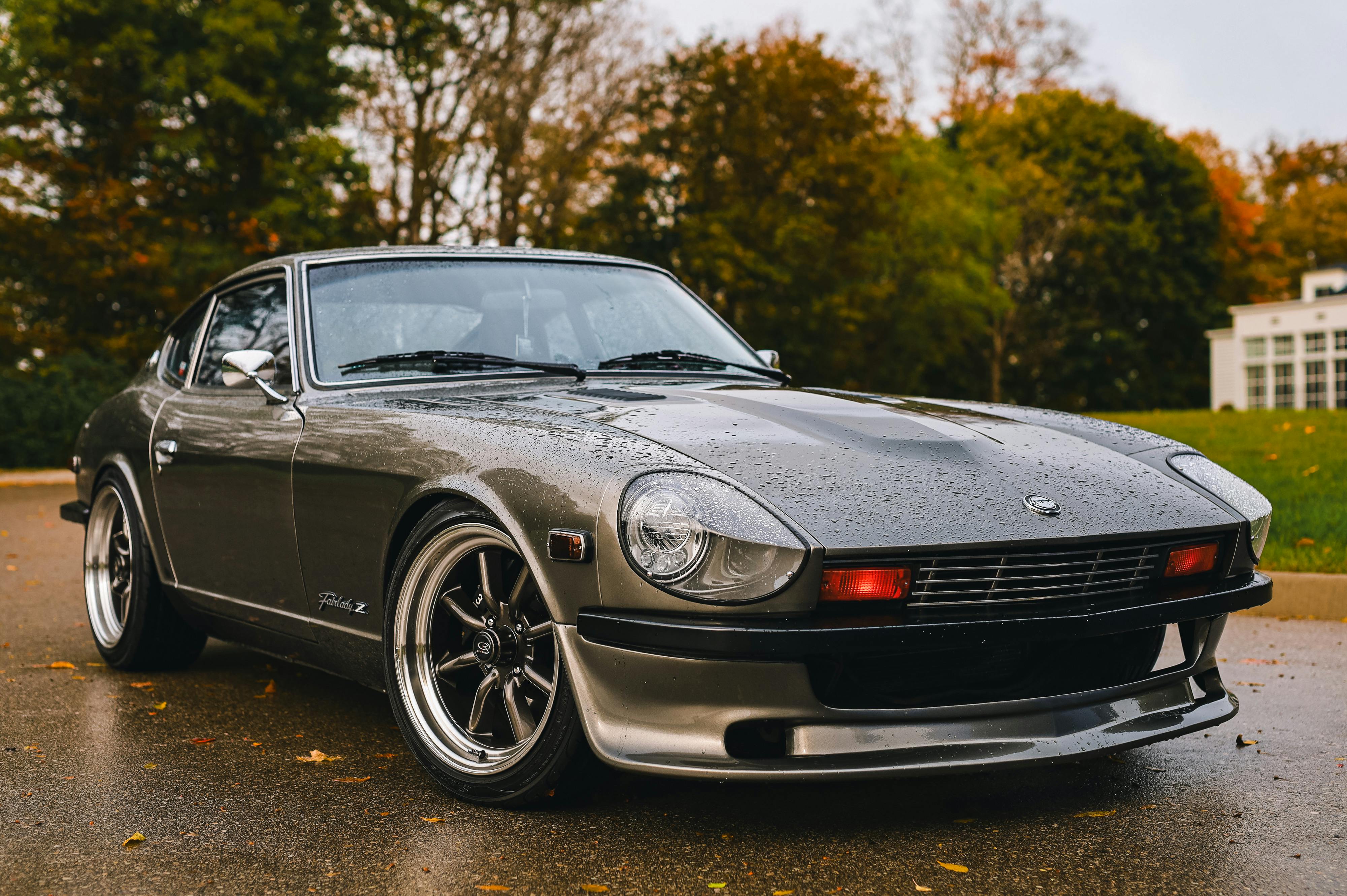 A Datsun 240Z on the Driveway on the Background of Autumnal Trees ...