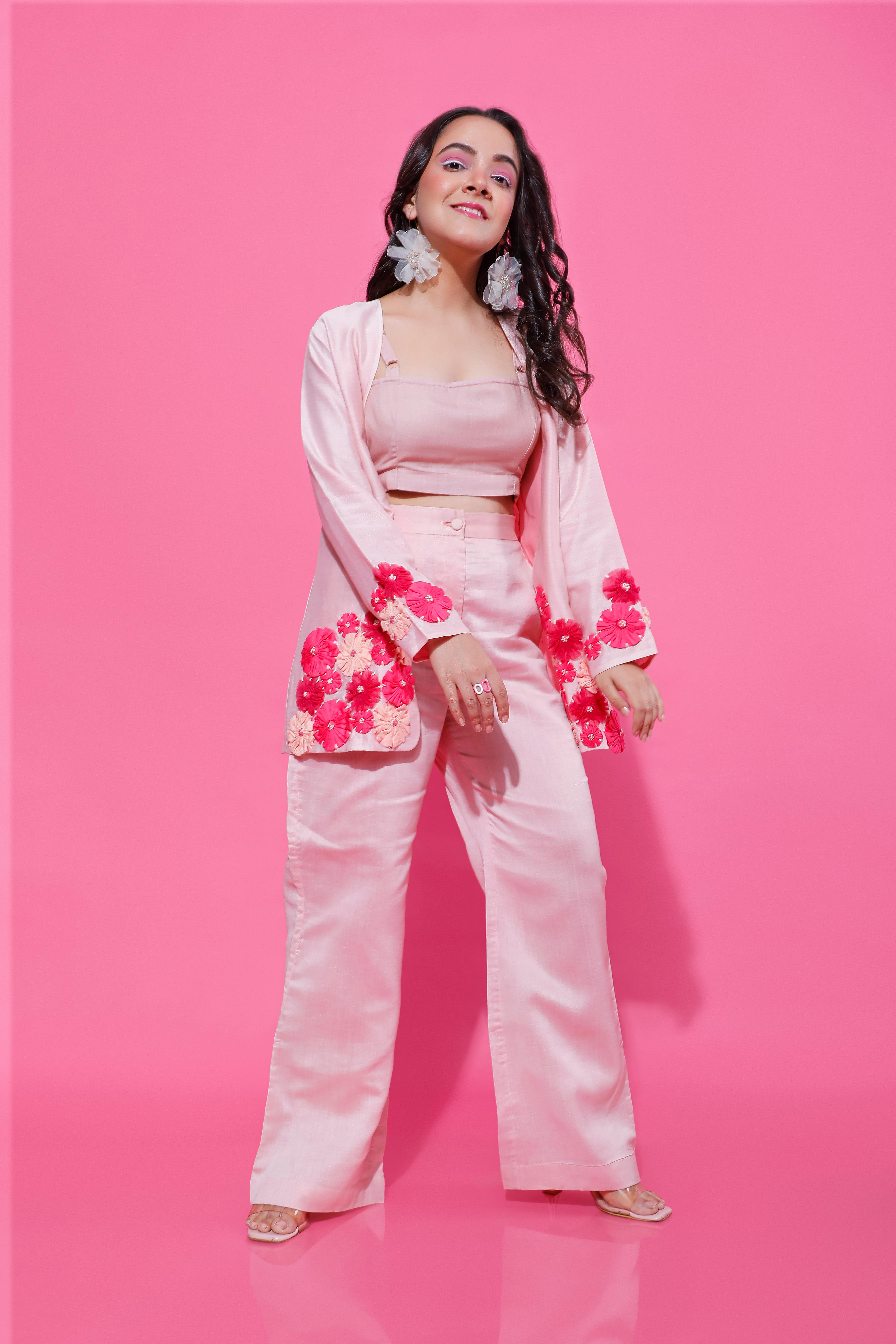Female Model Wearing Pink Clothes Standing against a Pink Background ...