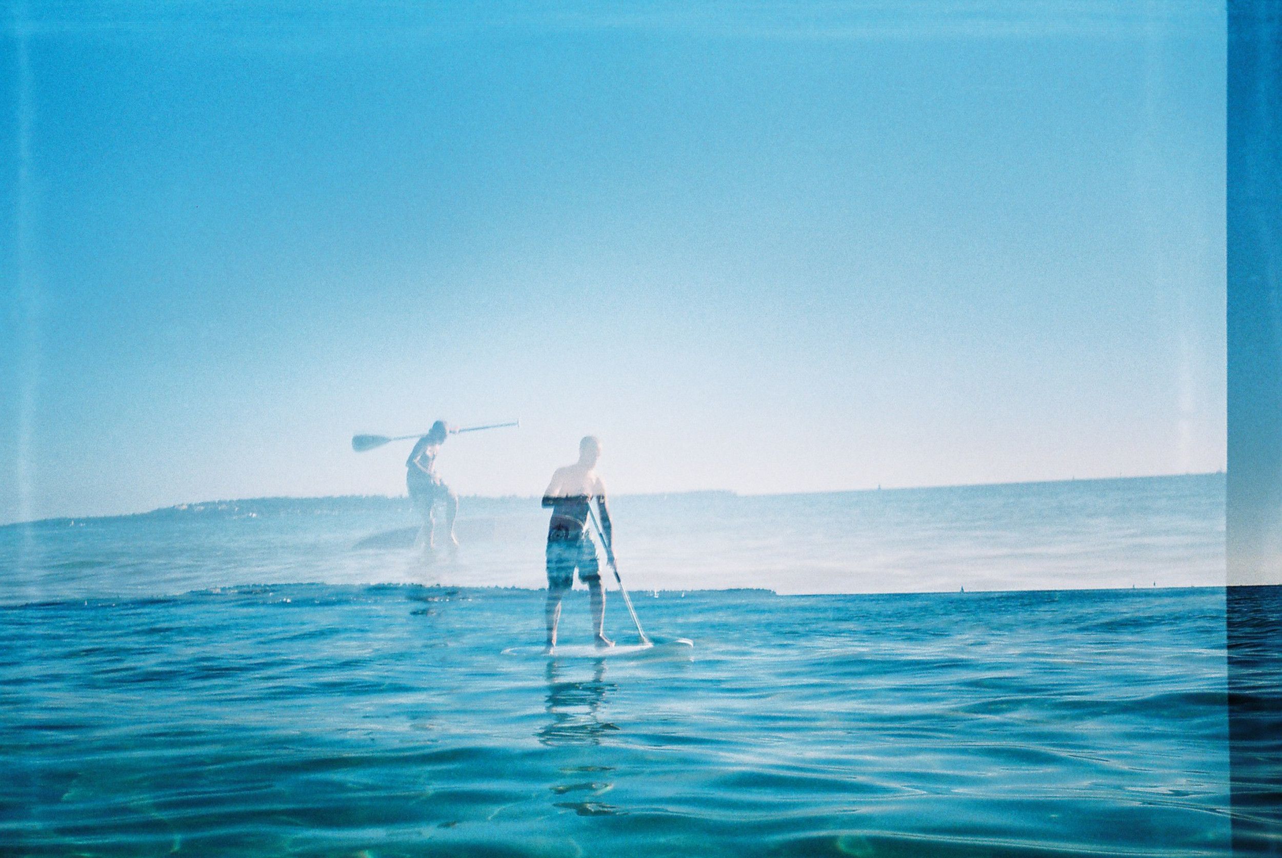 Man Swimming on a Desk Seen by the Glass · Free Stock Photo