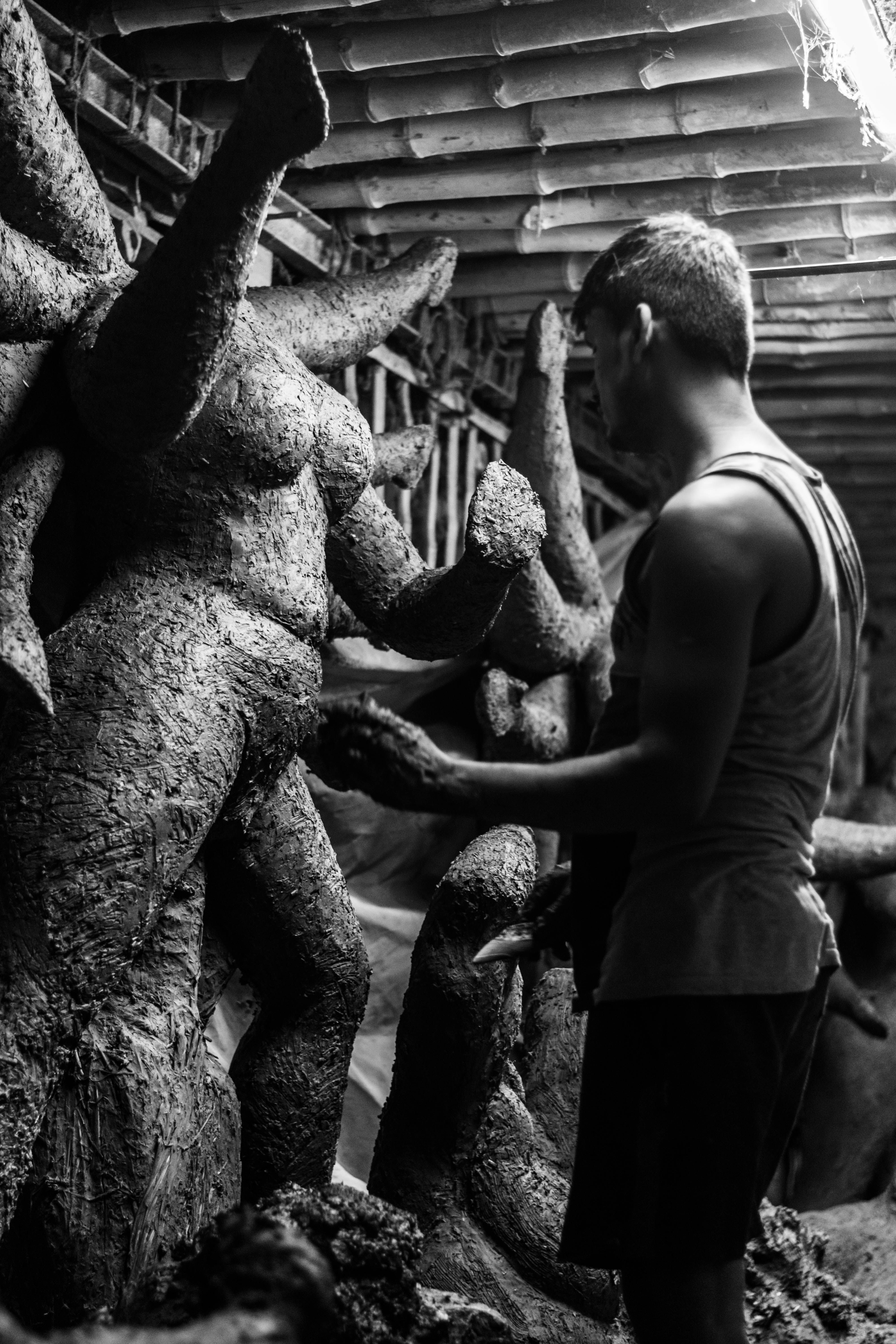 Sculptor Crafting Durga Idol in Kolkata Workshop · Free Stock Photo