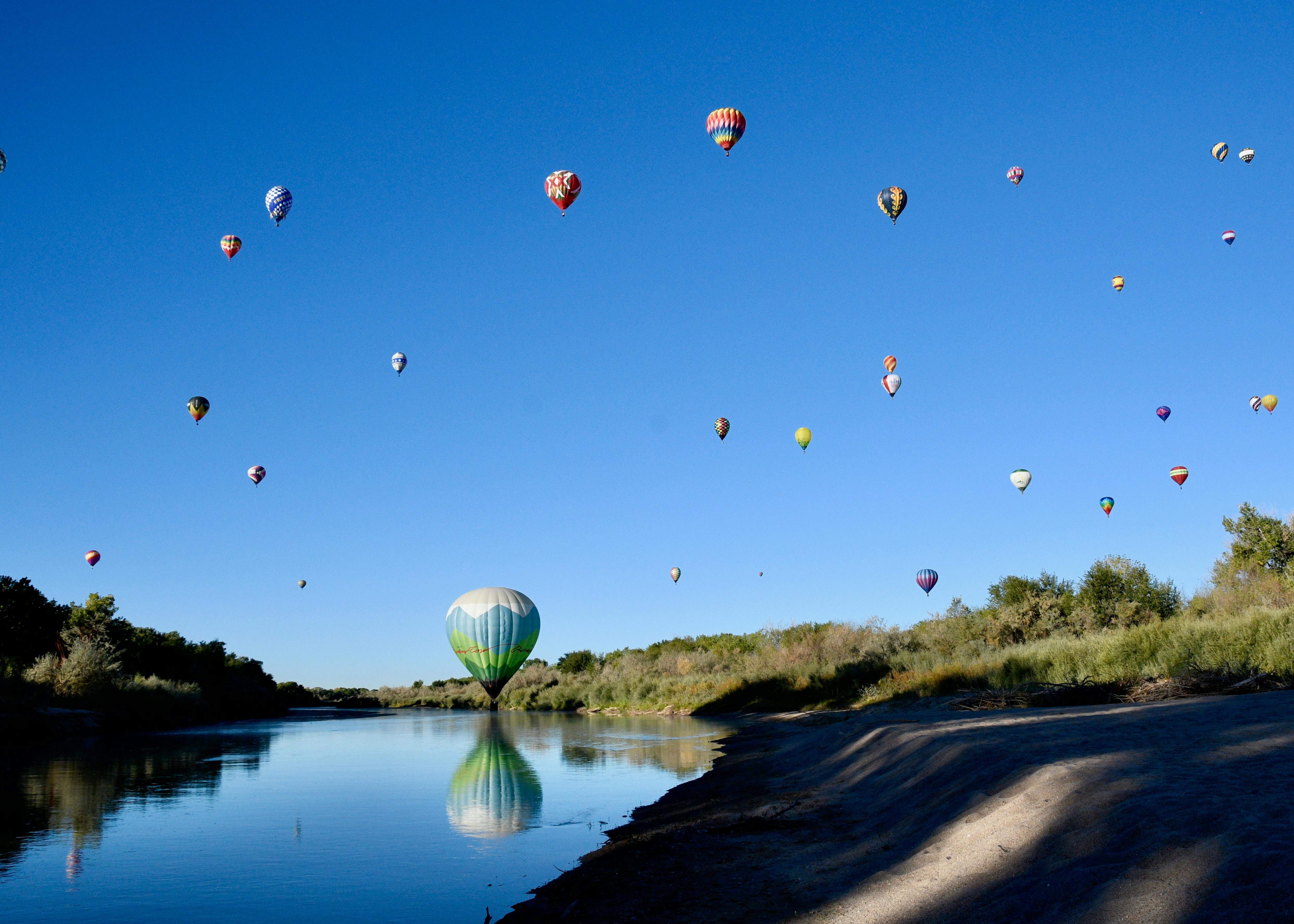 Balloon Landing in the River and a Swarm of Hot Air Balloons in the Sky ...