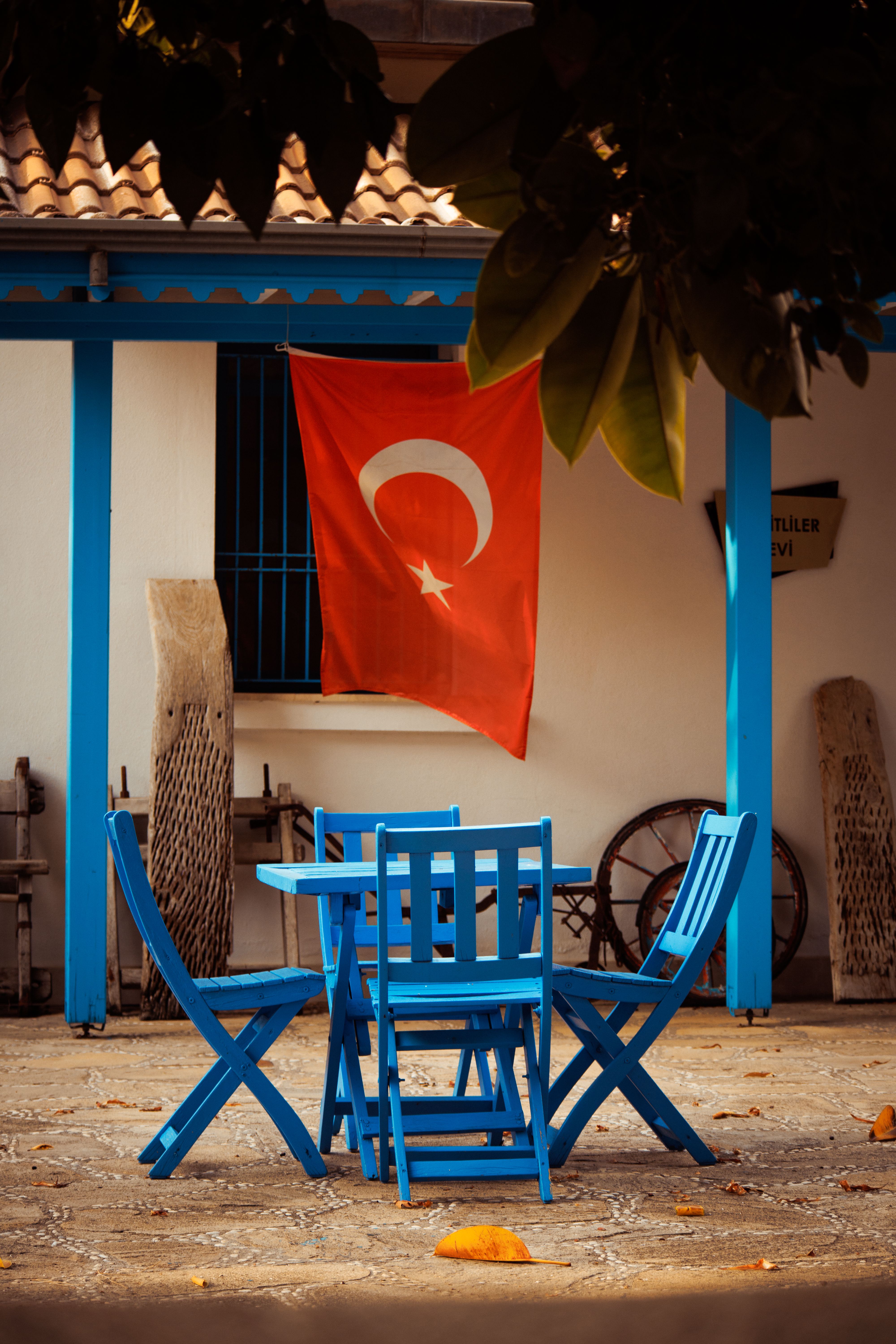 Flag and Table with Chairs on Terrace of House in Turkey · Free Stock Photo