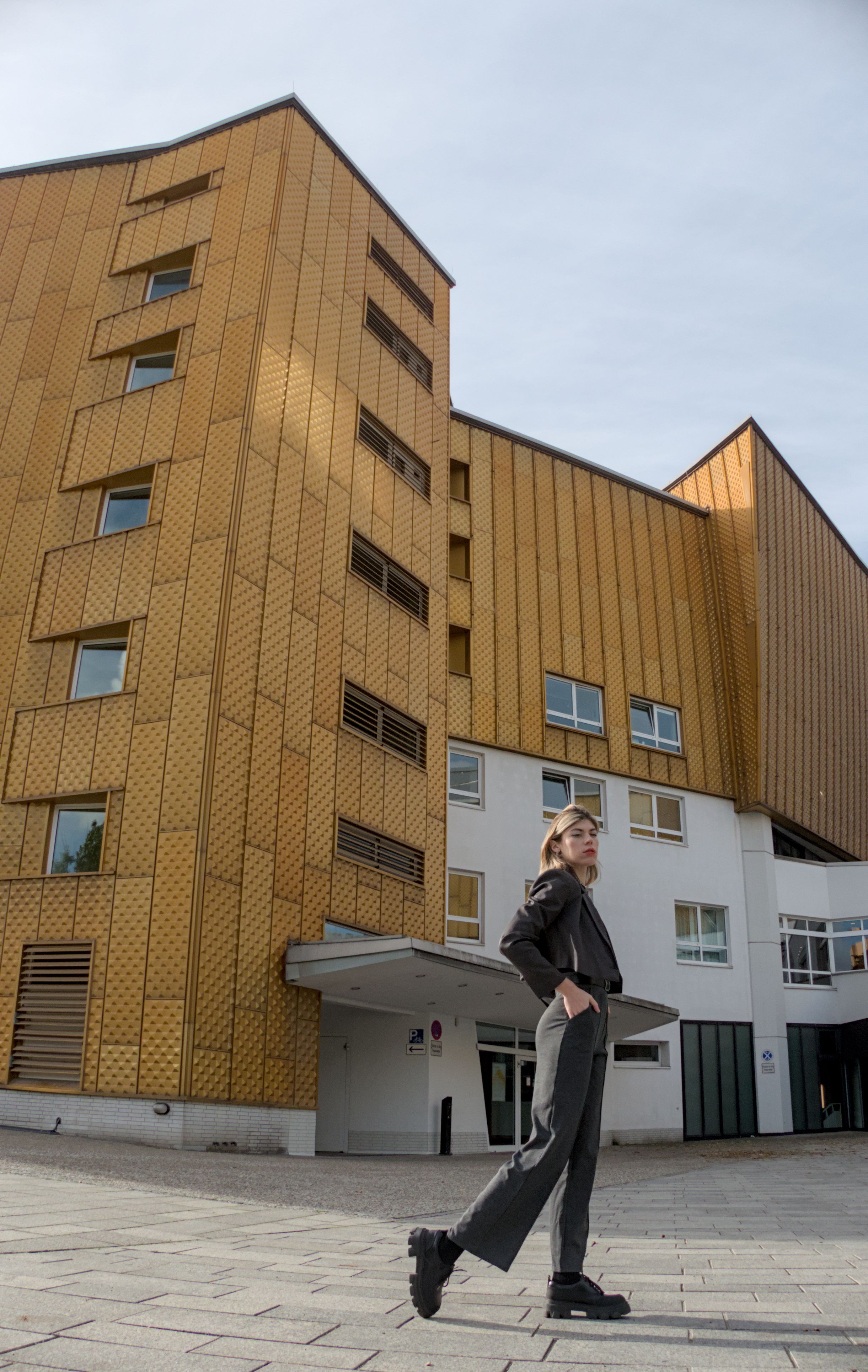 Woman Standing in front of a Building · Free Stock Photo