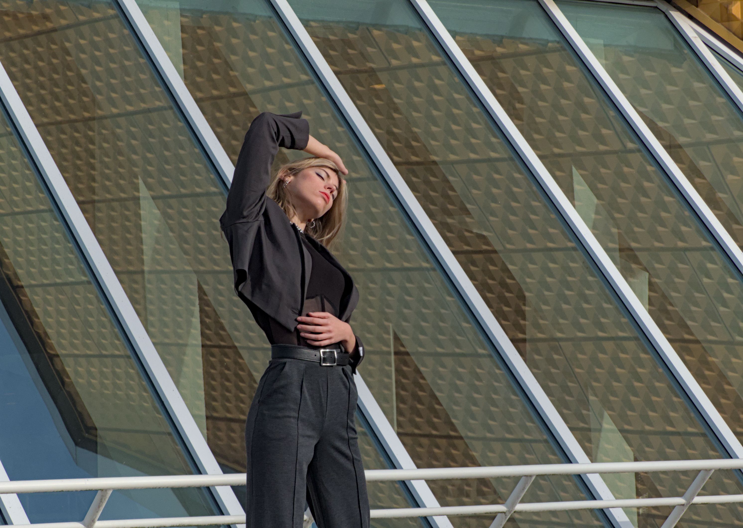 Woman Posing in front of a Building · Free Stock Photo