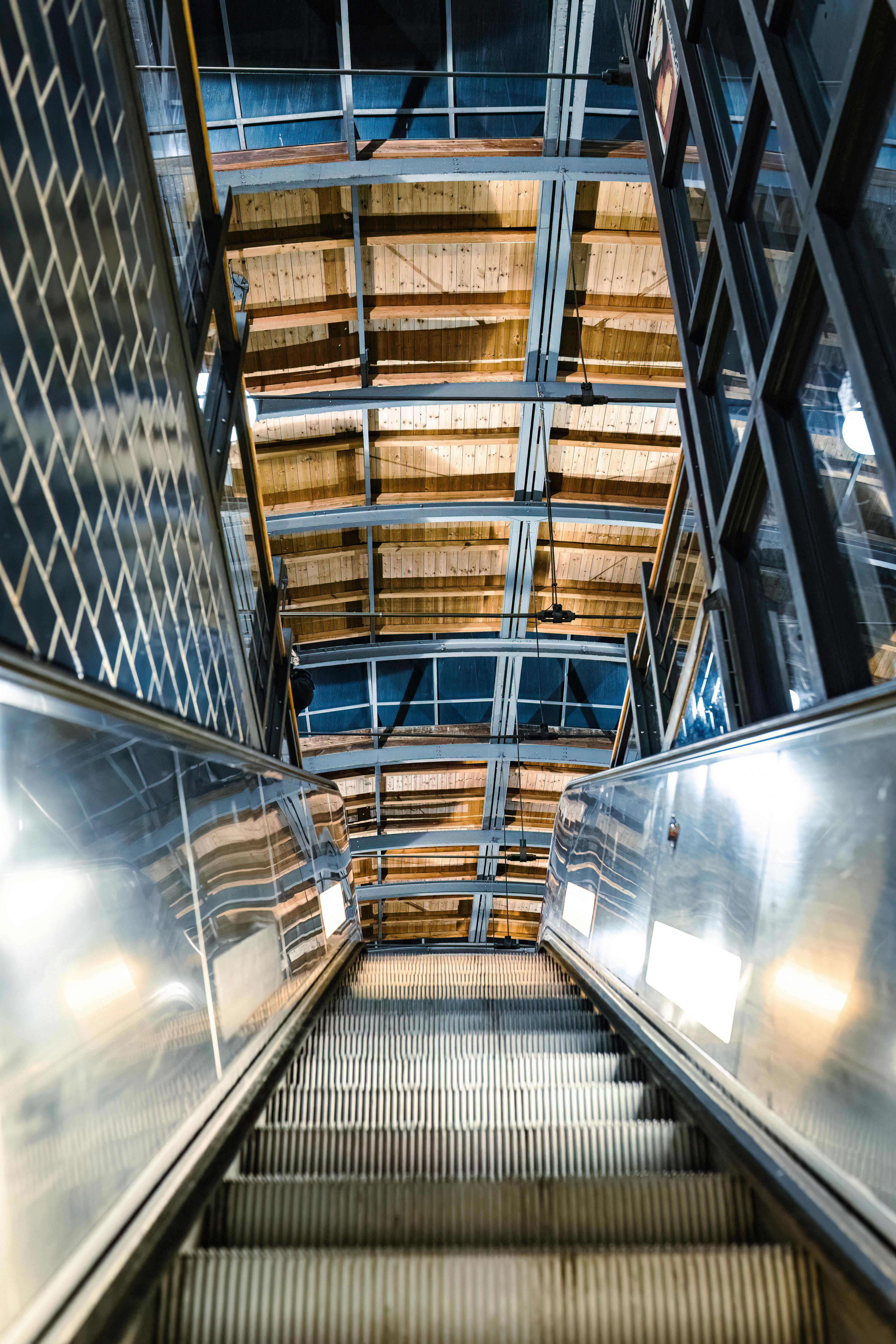 Metal Escalator and a Wooden Ceiling Structure · Free Stock Photo