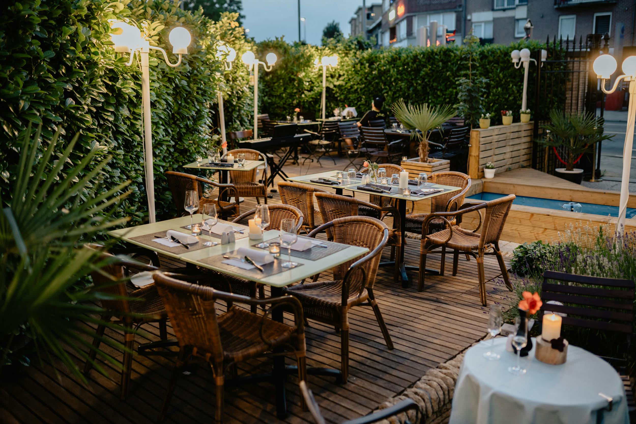 Street view of a coffee terrace with tables and chairs · Free Stock Photo