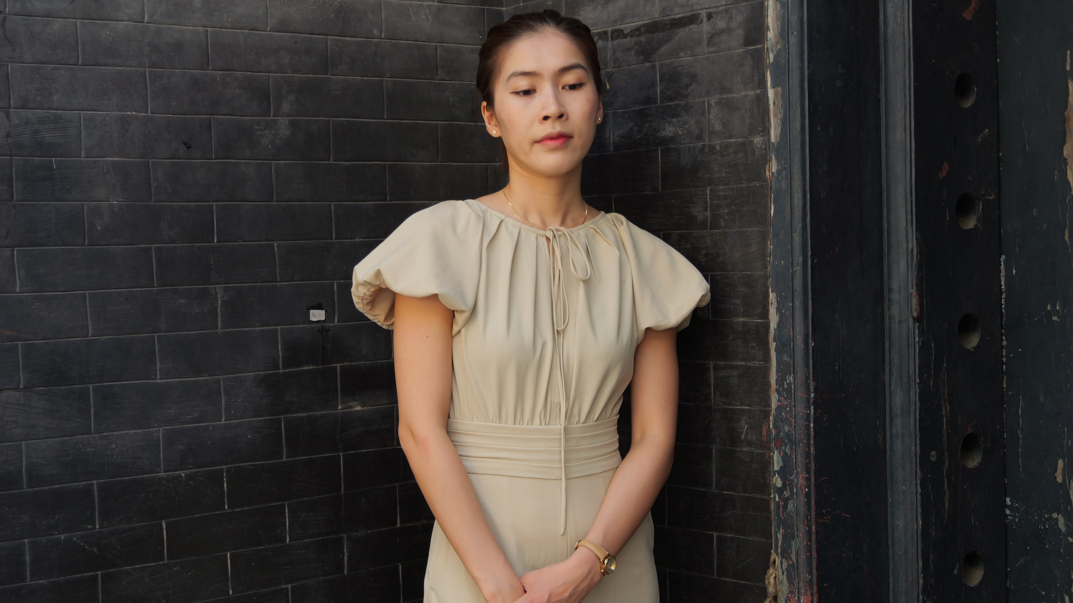 Model in a Light Beige Dress with Short Puffed Sleeves · Free Stock Photo