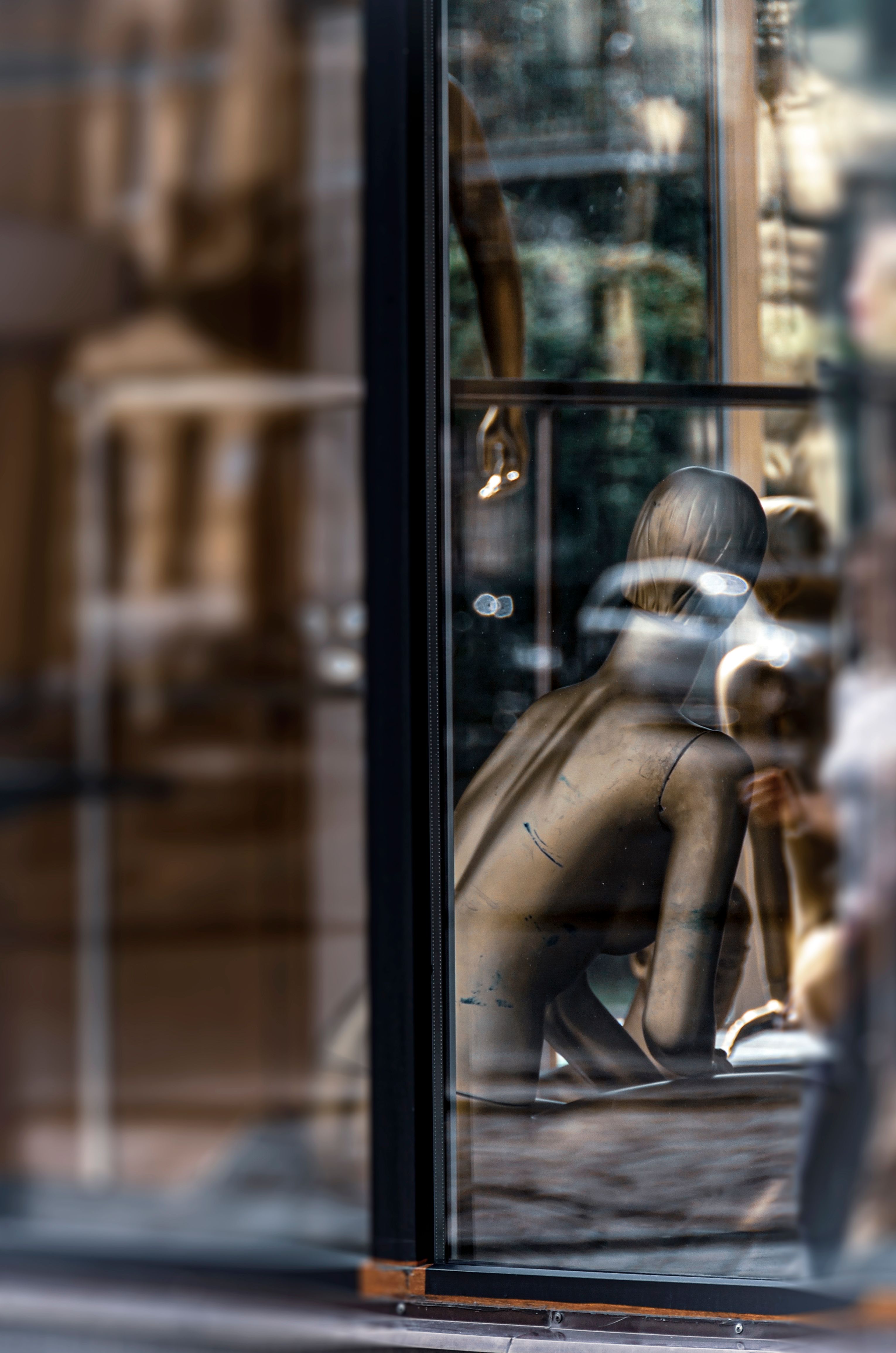 Sculptures Behind a Window · Free Stock Photo