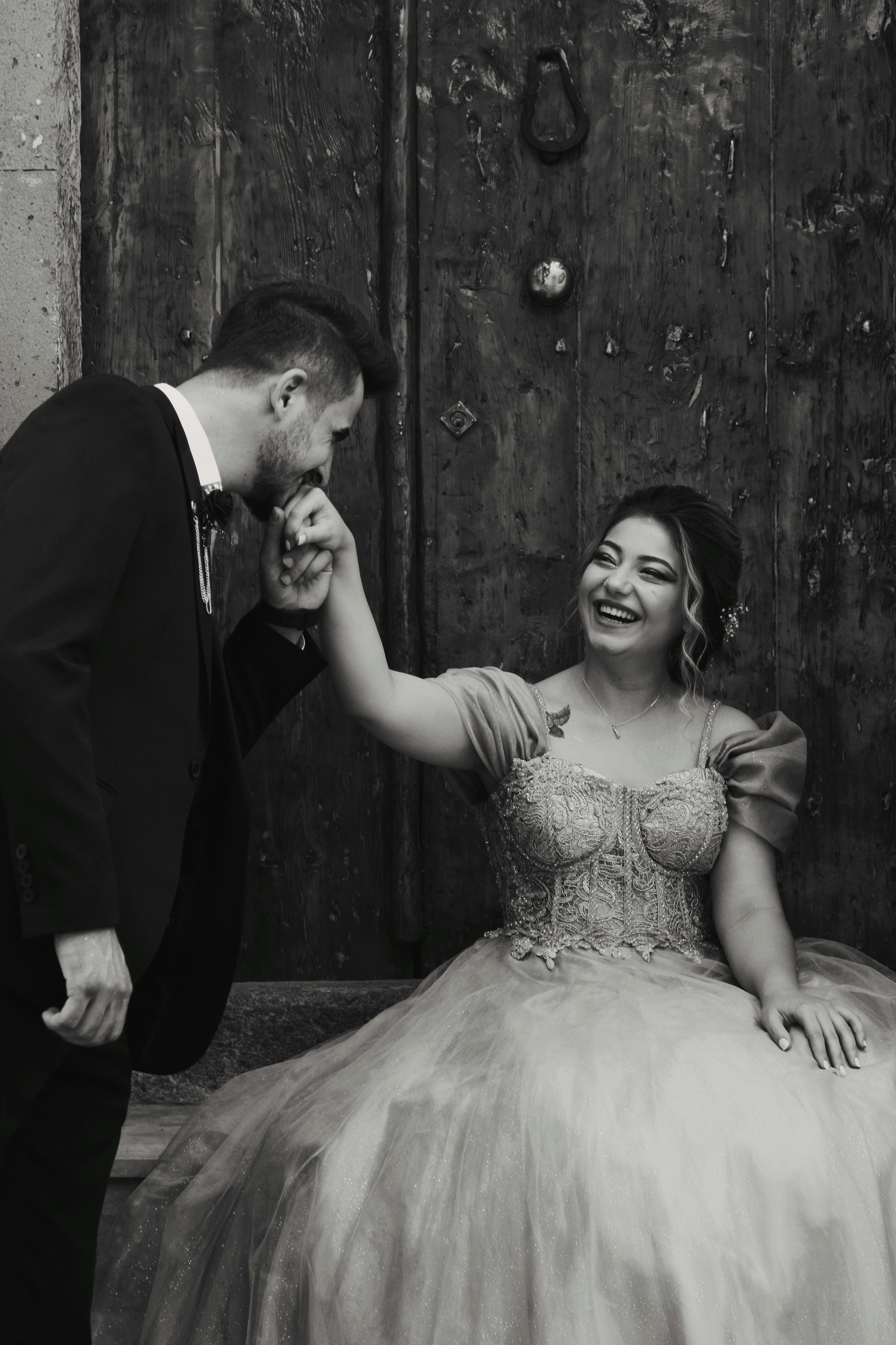 Groom Kissing the Bride Hand · Free Stock Photo