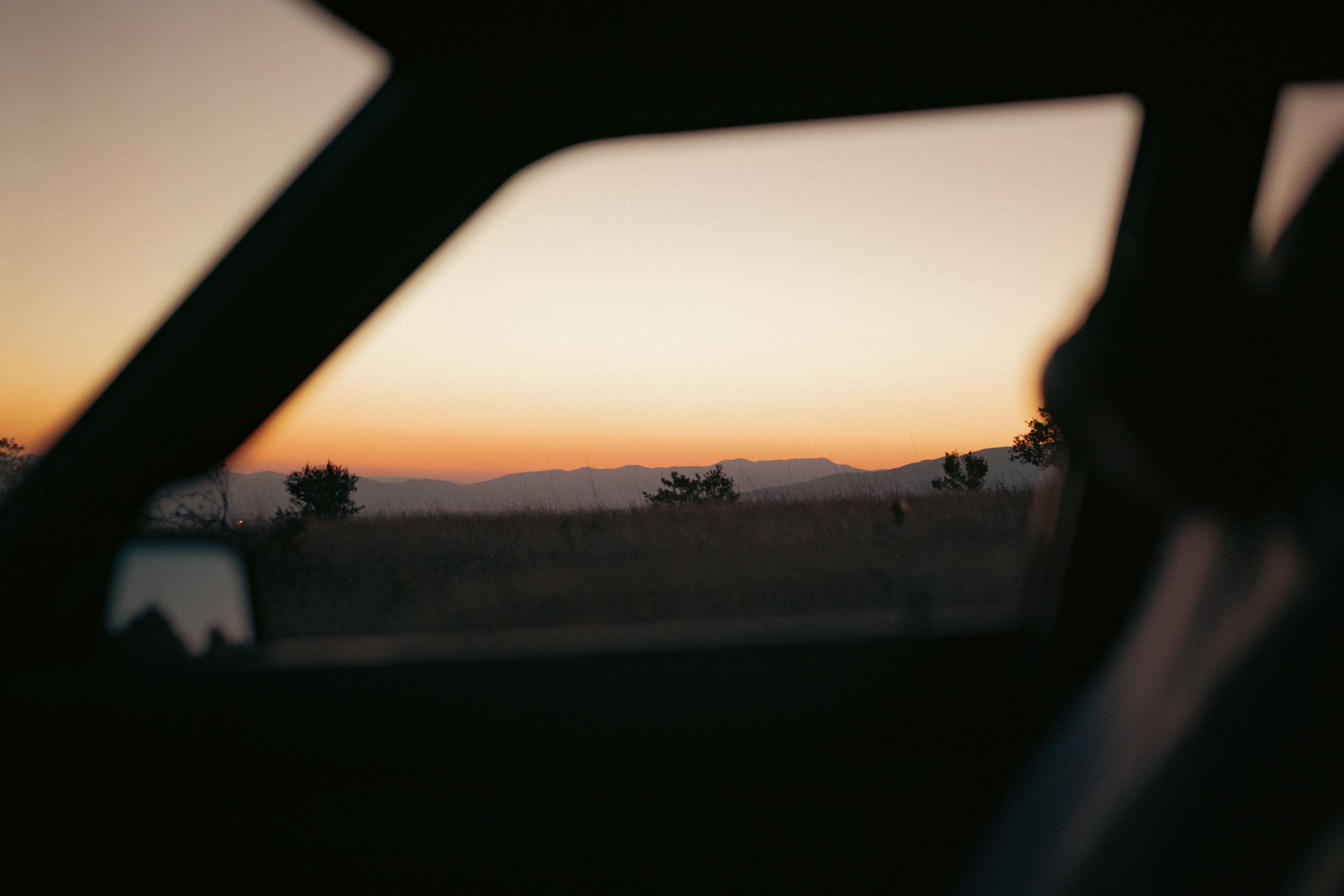 Landscape from a Car Window at Sunset · Free Stock Photo