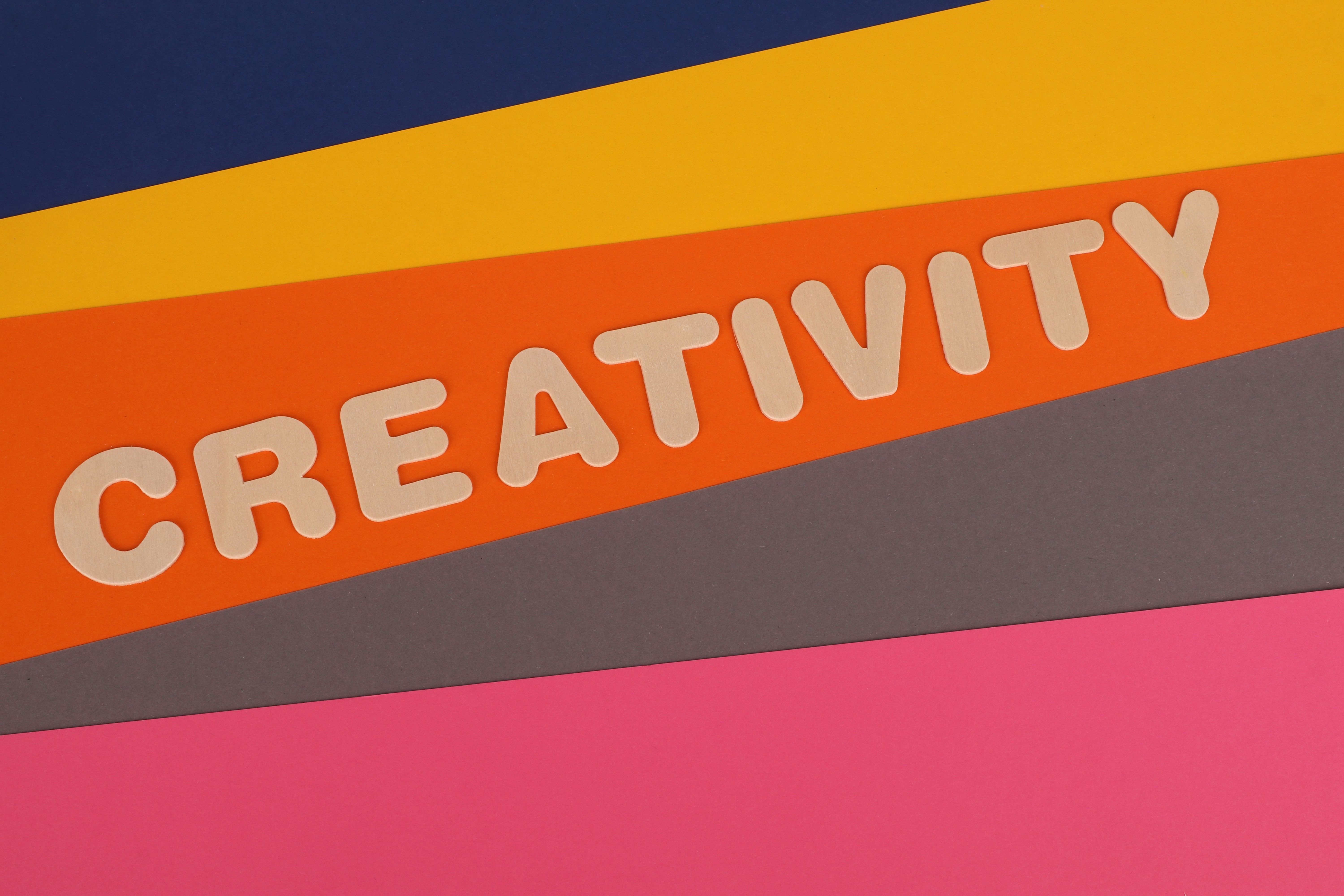 Word Creativity on a Colorful Background · Free Stock Photo