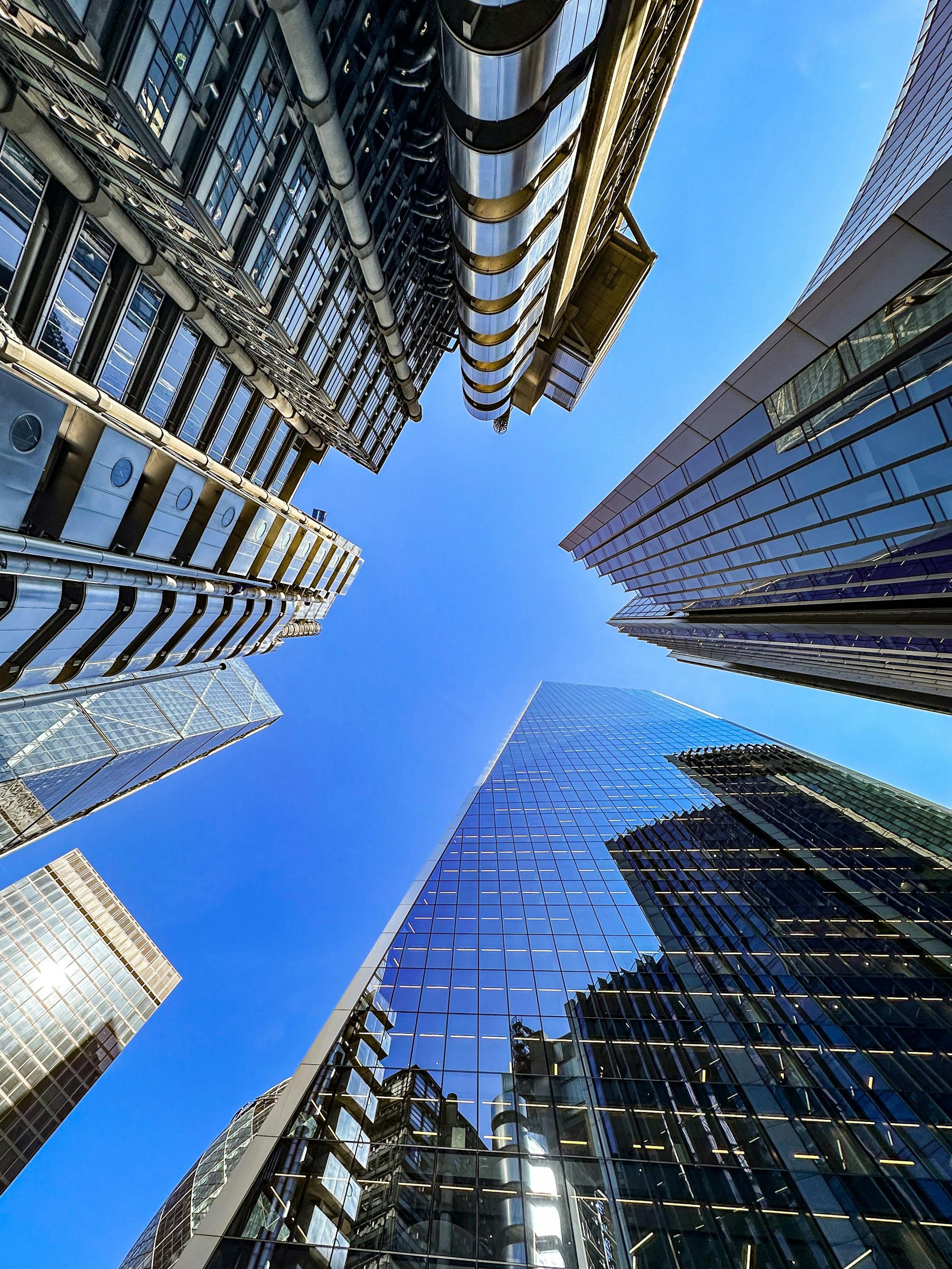 Buildings in City Against Blue Sky · Free Stock Photo