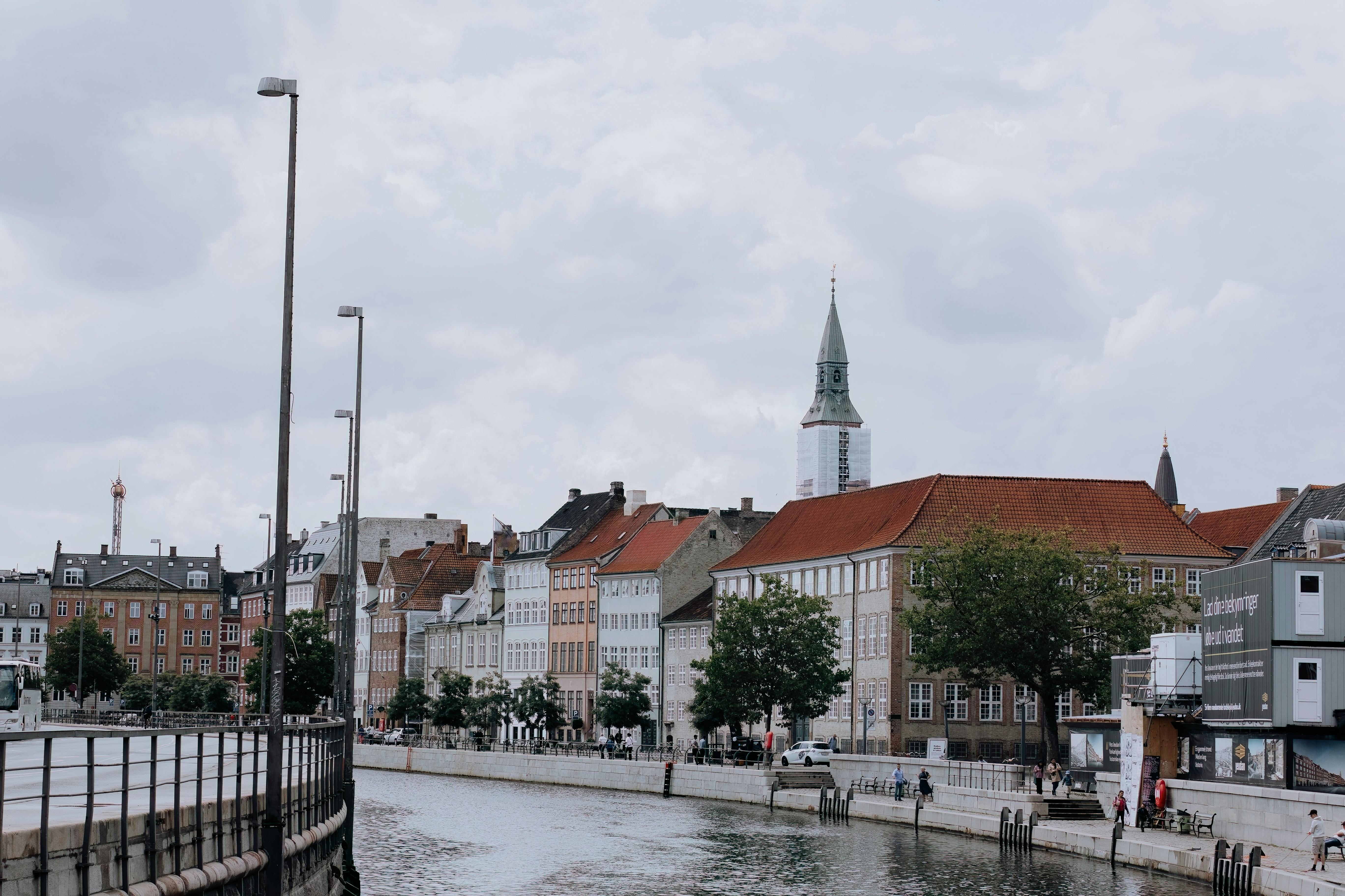 Assorted-color Buildings Near Water and Trees · Free Stock Photo