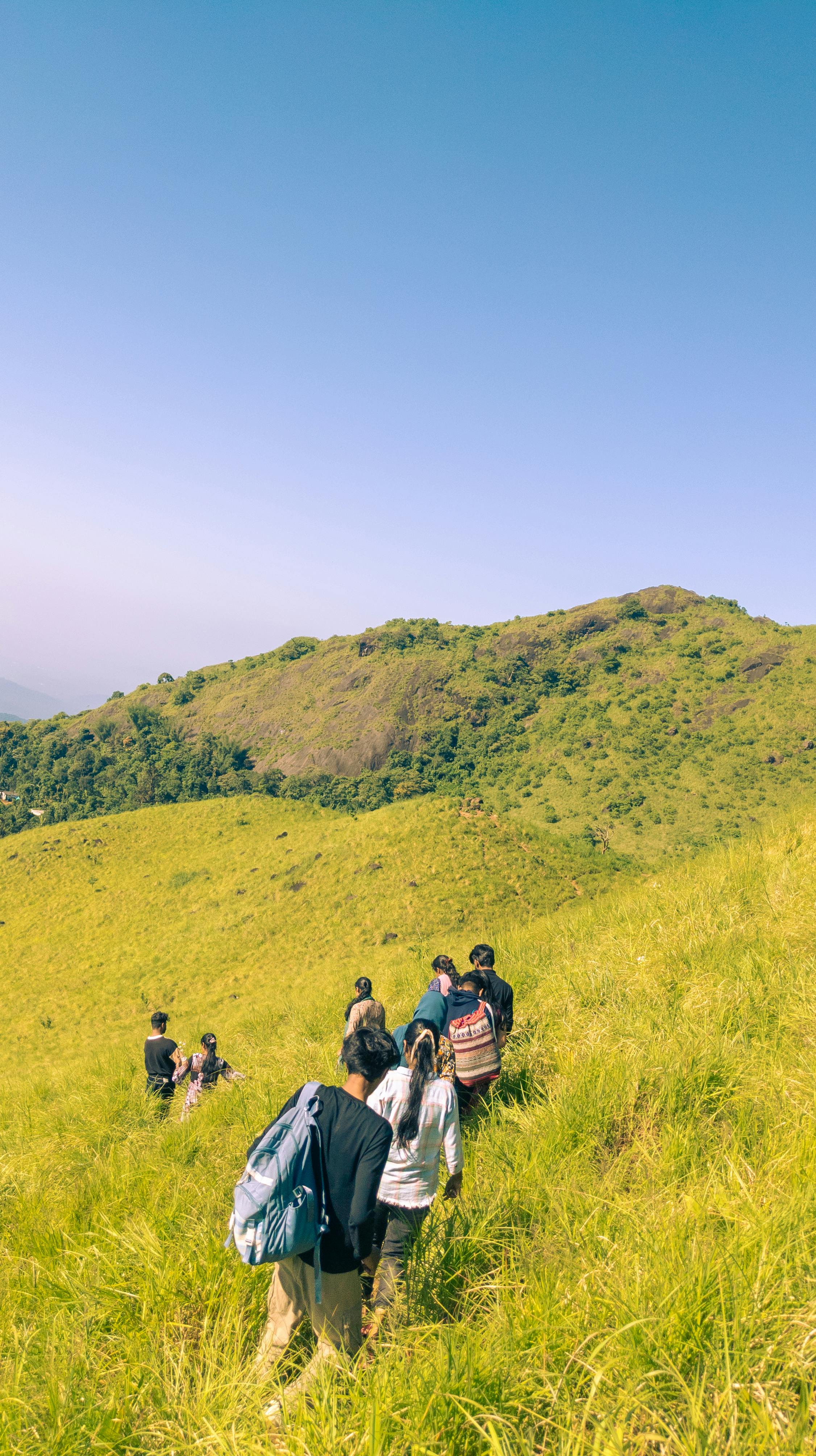 Man Walking Along the Footpath on the Hillside Towards the River · Free ...