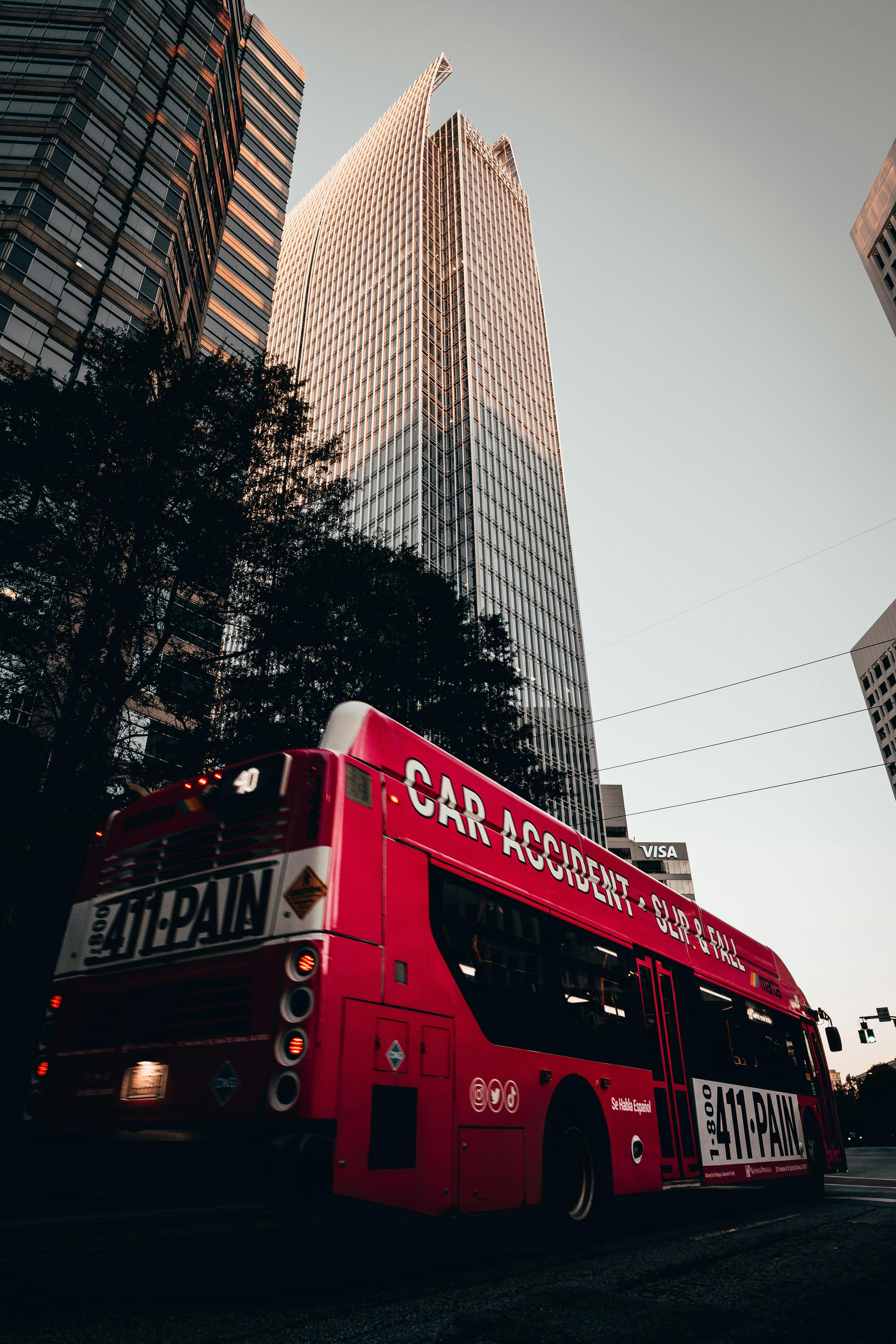 Red Bus of 411 PAIN in Downtown · Free Stock Photo