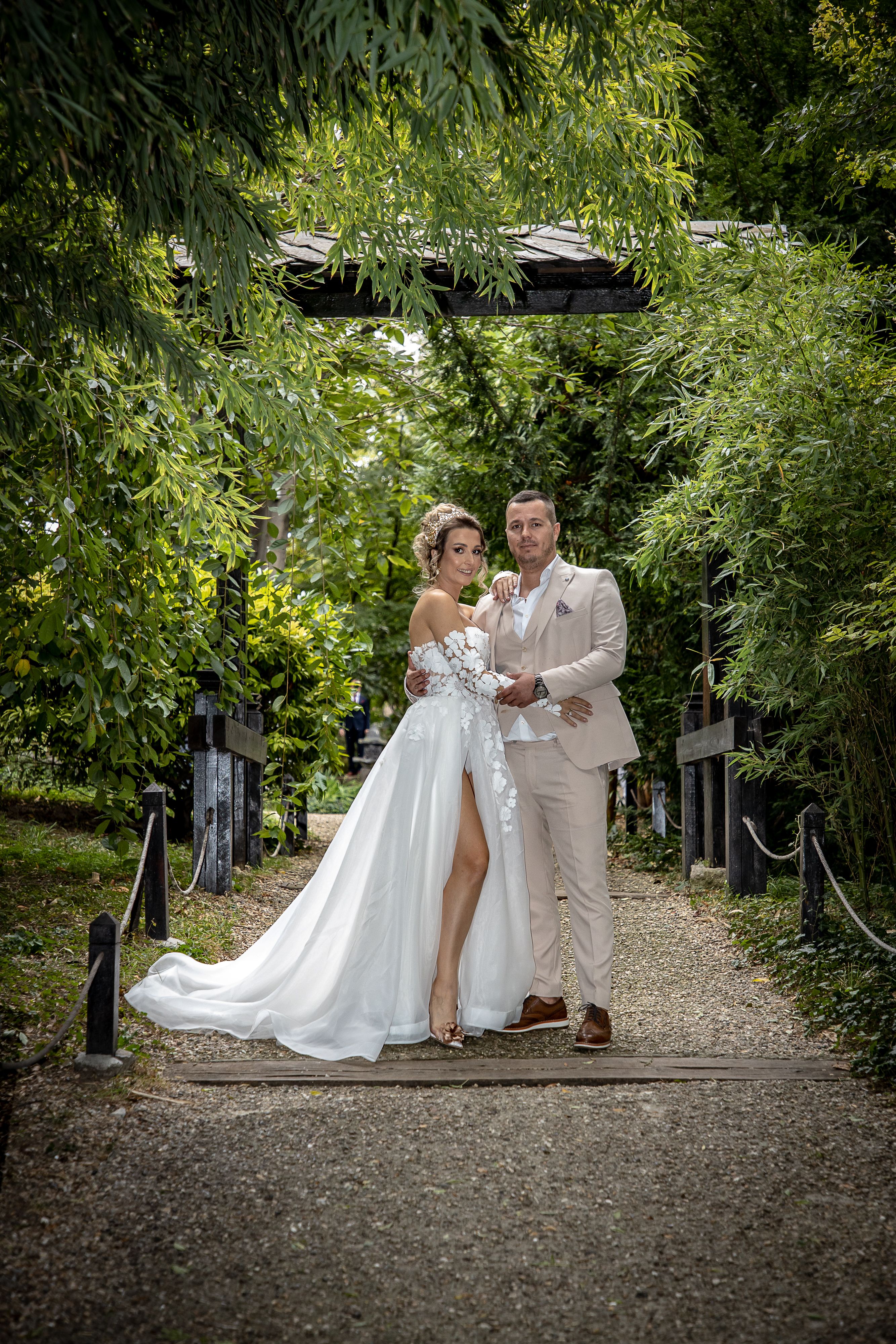 Photo of a Standing Wedding Couple Wearing Traditional Wedding Dress ...