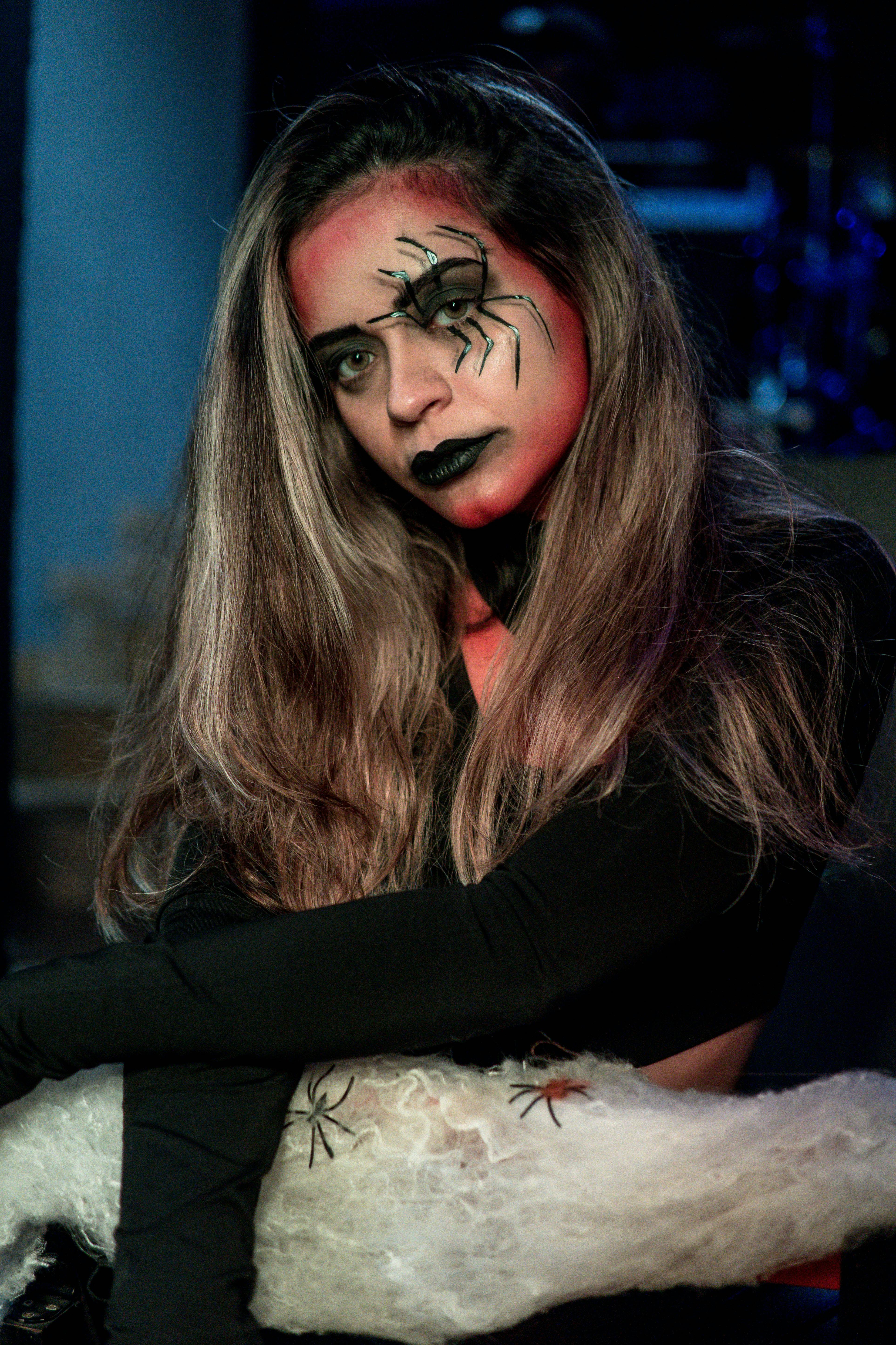 Spider Lady Holding Lump of Cobweb with Spiders on Her Knees · Free ...